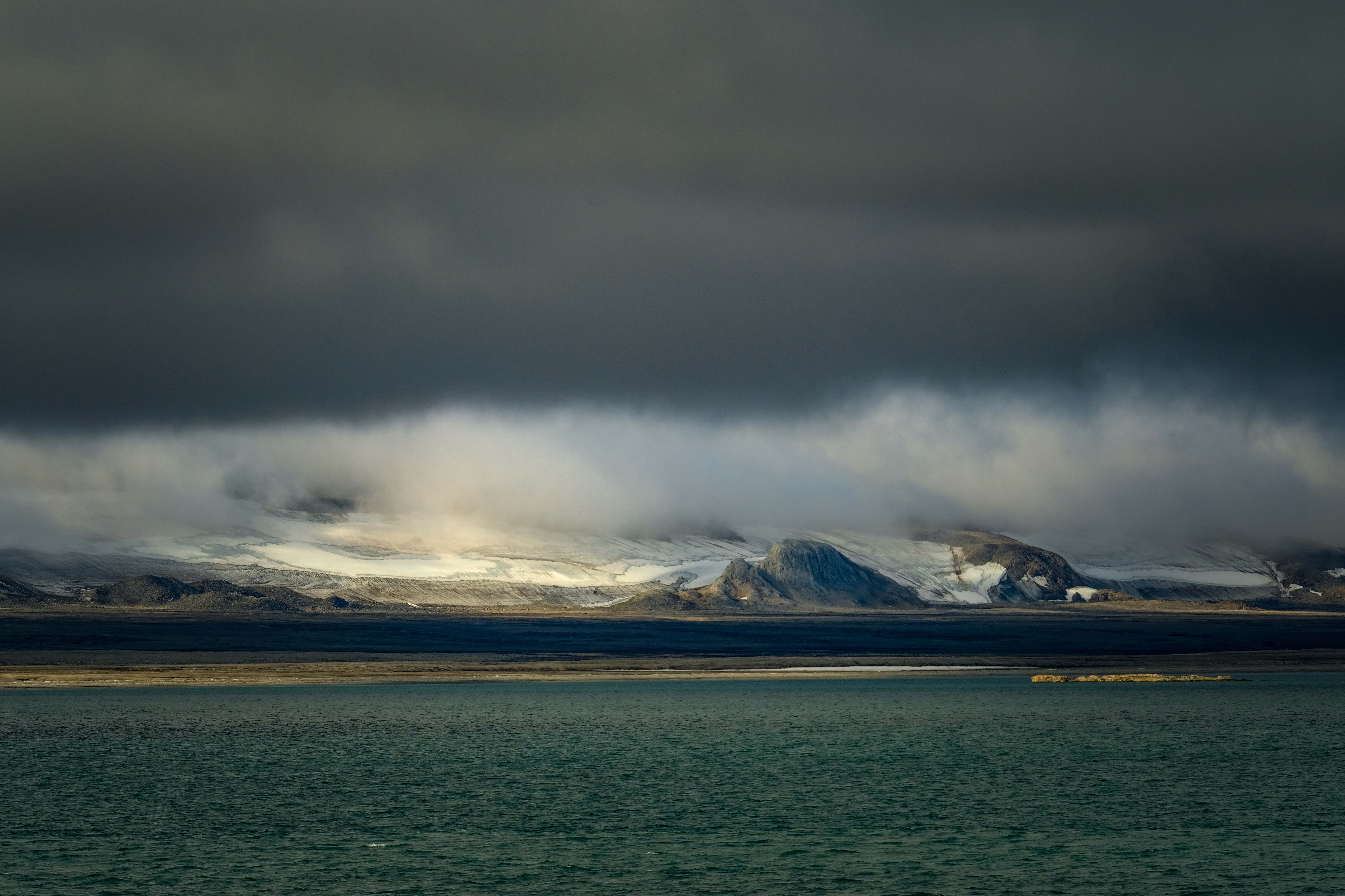 Dramatic Arctic Landscape with Stormy Sky · Free Stock Photo