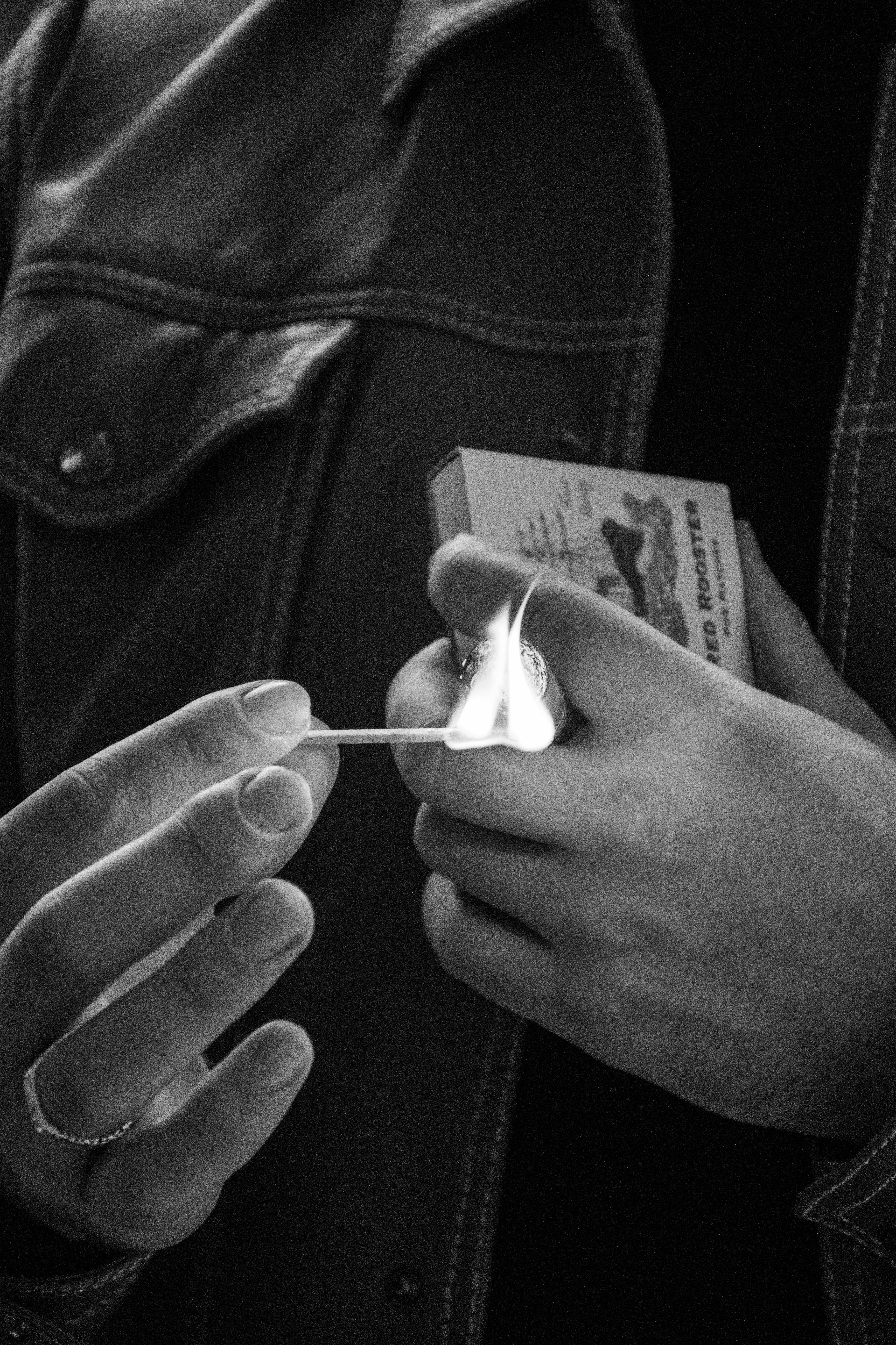 Close-up of a Match Being Lit in Black and White · Free Stock Photo