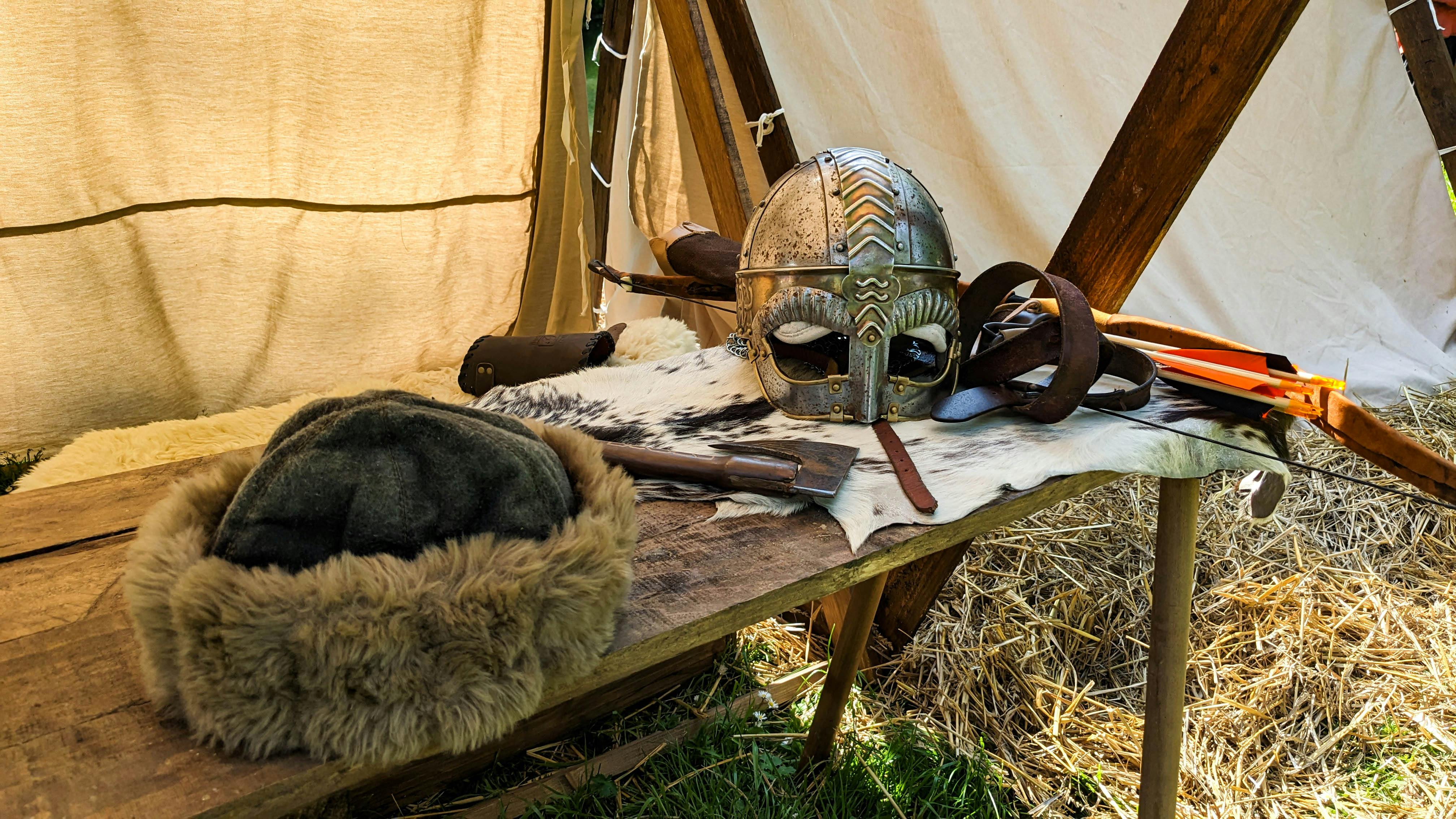 Medieval Viking Helmet and Gear in Tent Setup · Free Stock Photo