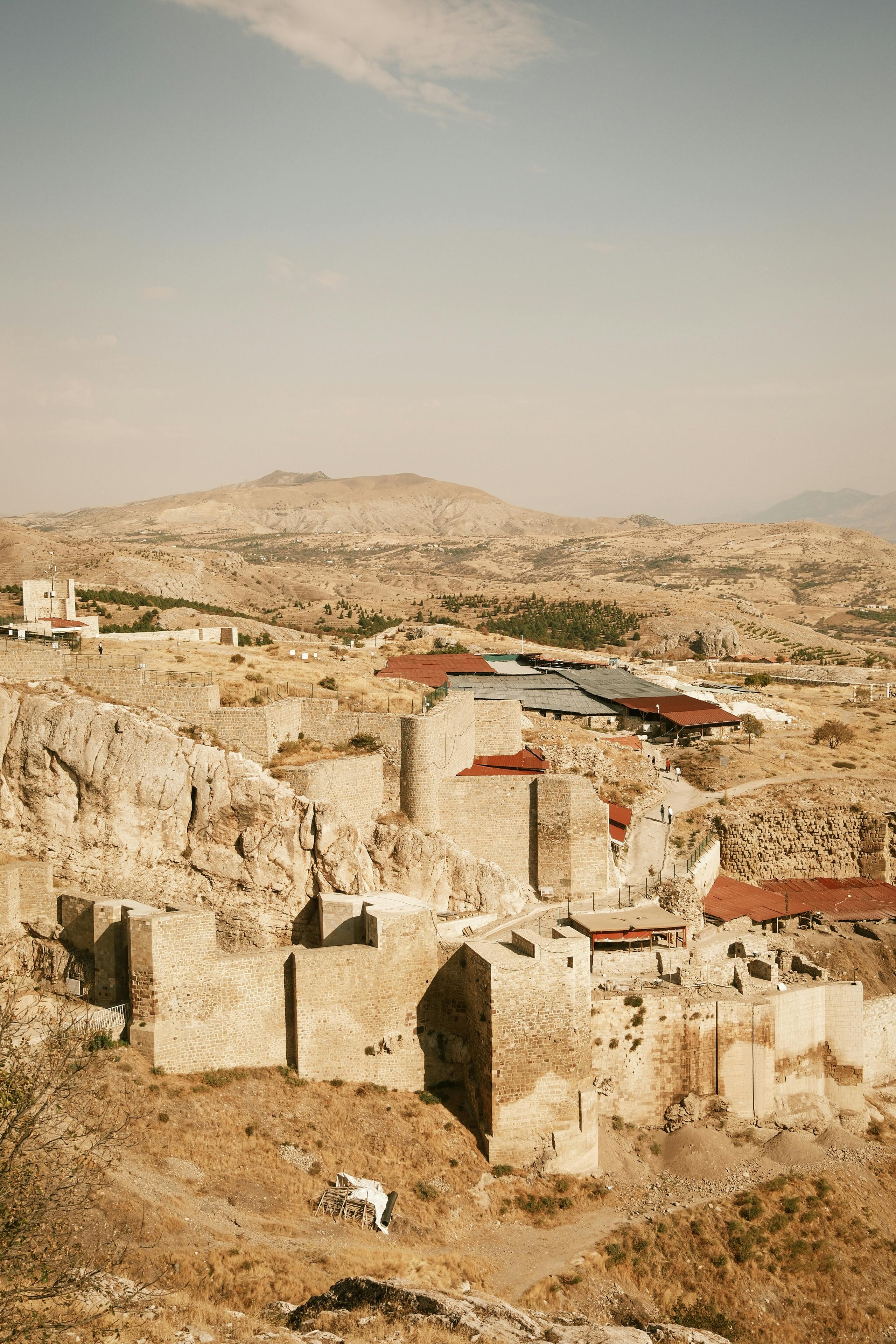 Ancient Mountain Fortress Ruins in Desert Landscape · Free Stock Photo