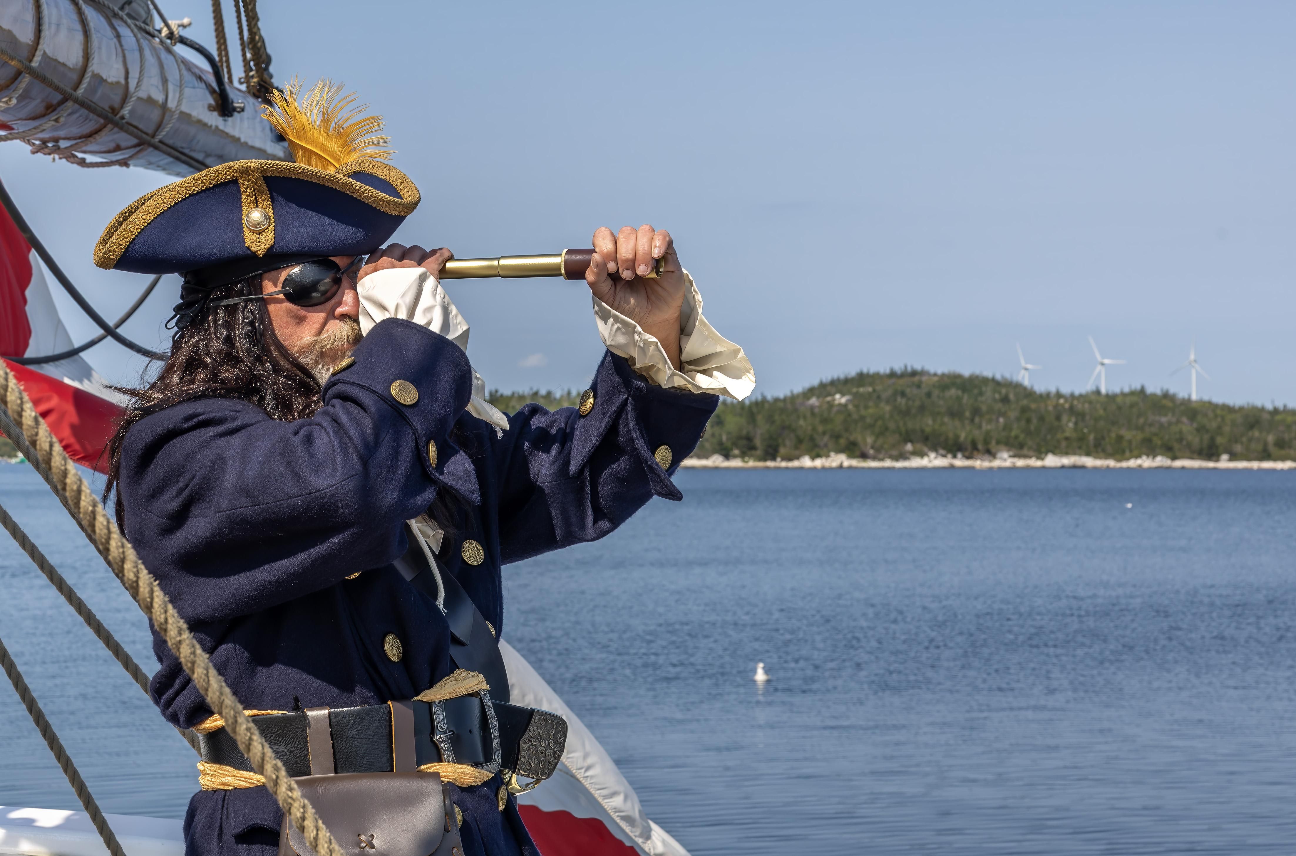 Pirate in Costume with Spyglass on Ship · Free Stock Photo