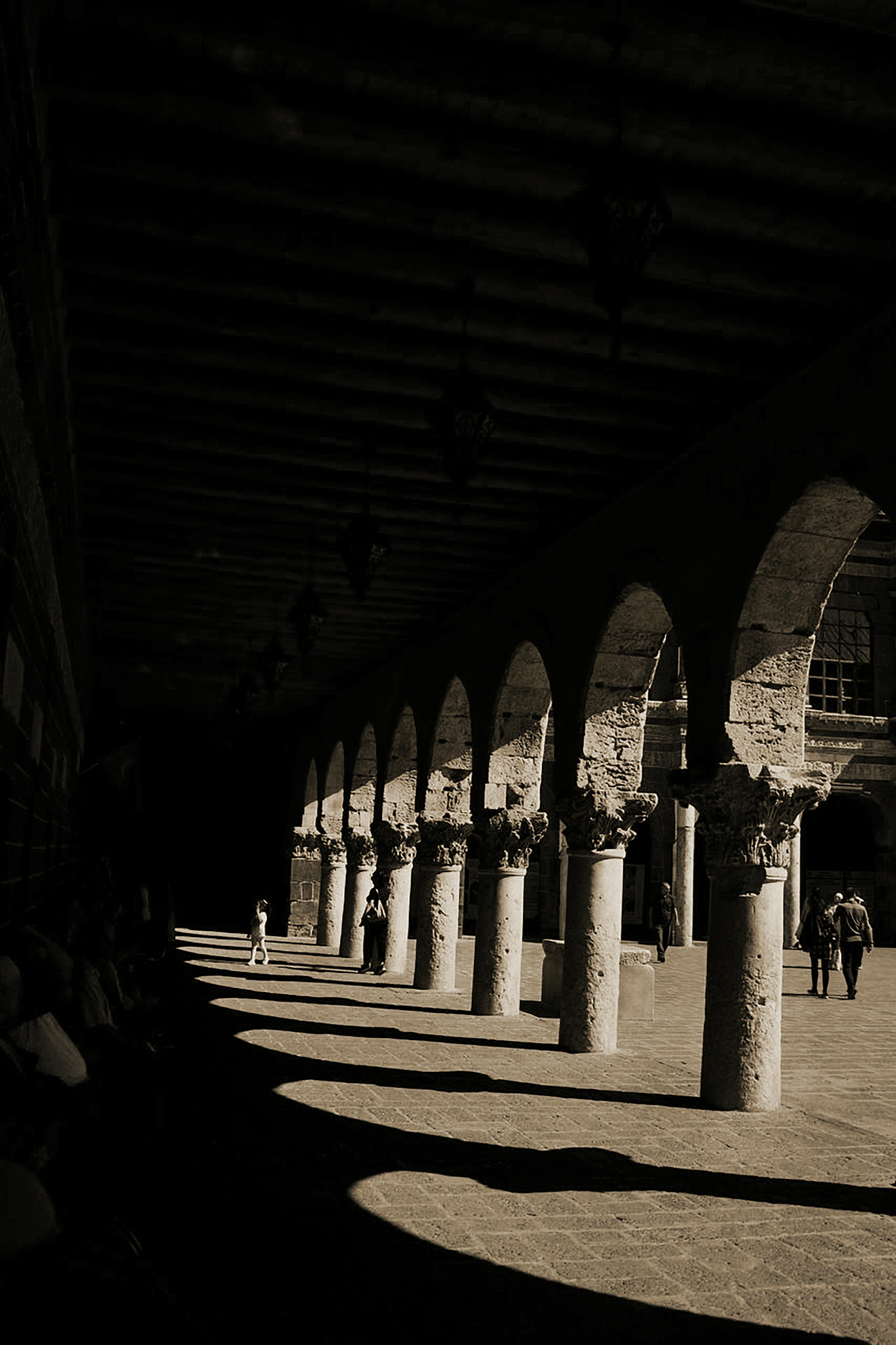 Dramatic Shadows in Historic Stone Colonnade · Free Stock Photo
