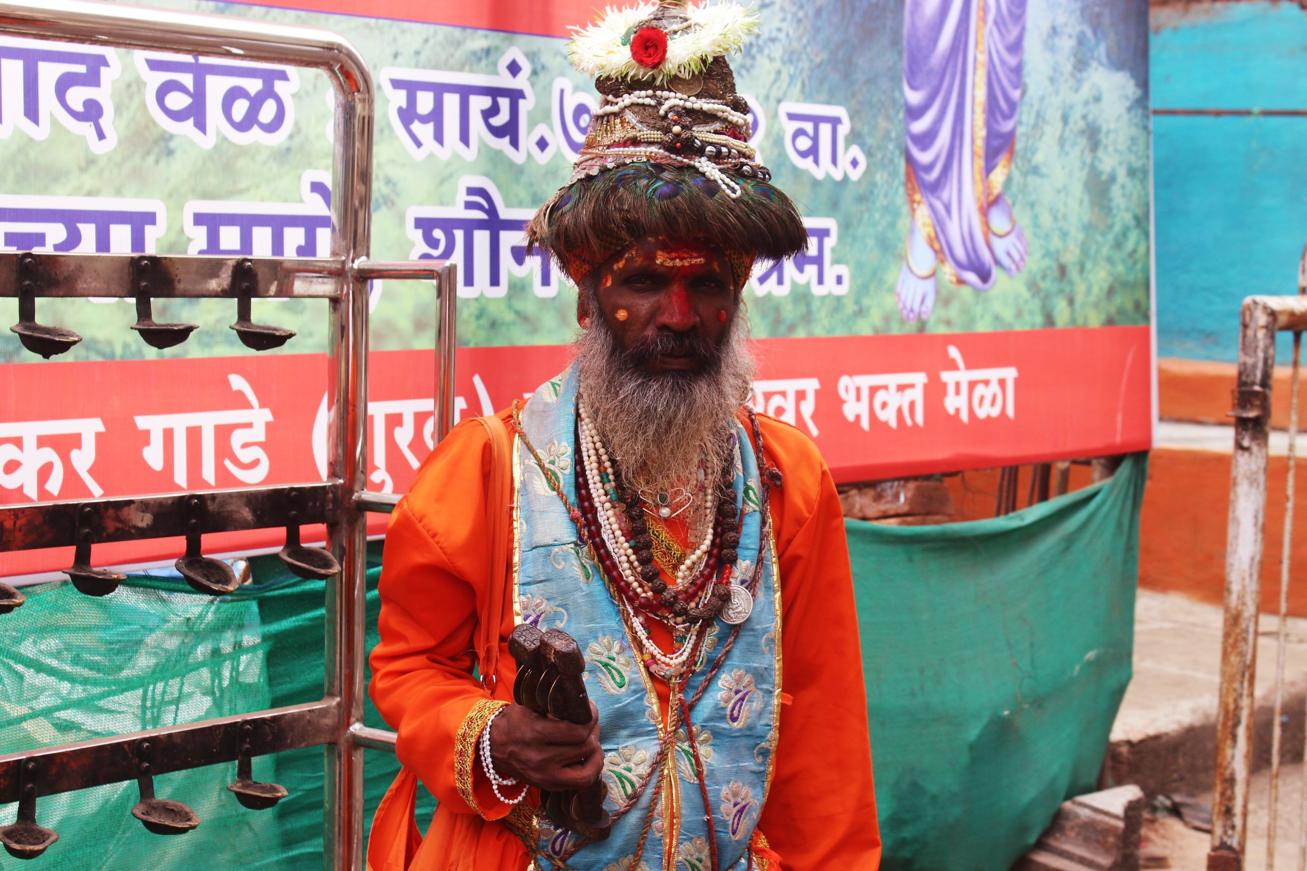 Colorful Hindu Holy Man in Traditional Attire · Free Stock Photo