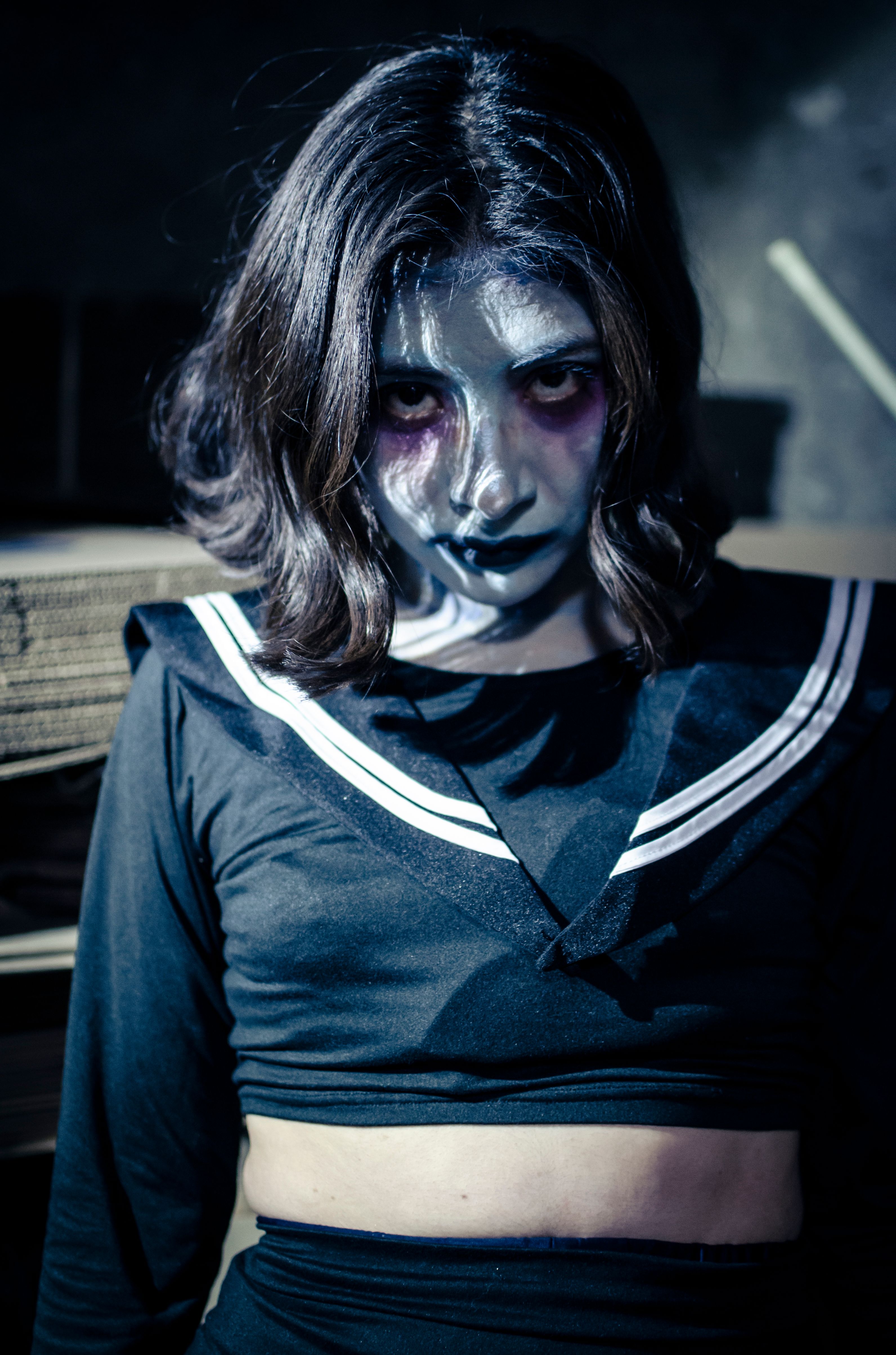 Spooky Woman with Horror Makeup in Dark Setting · Free Stock Photo
