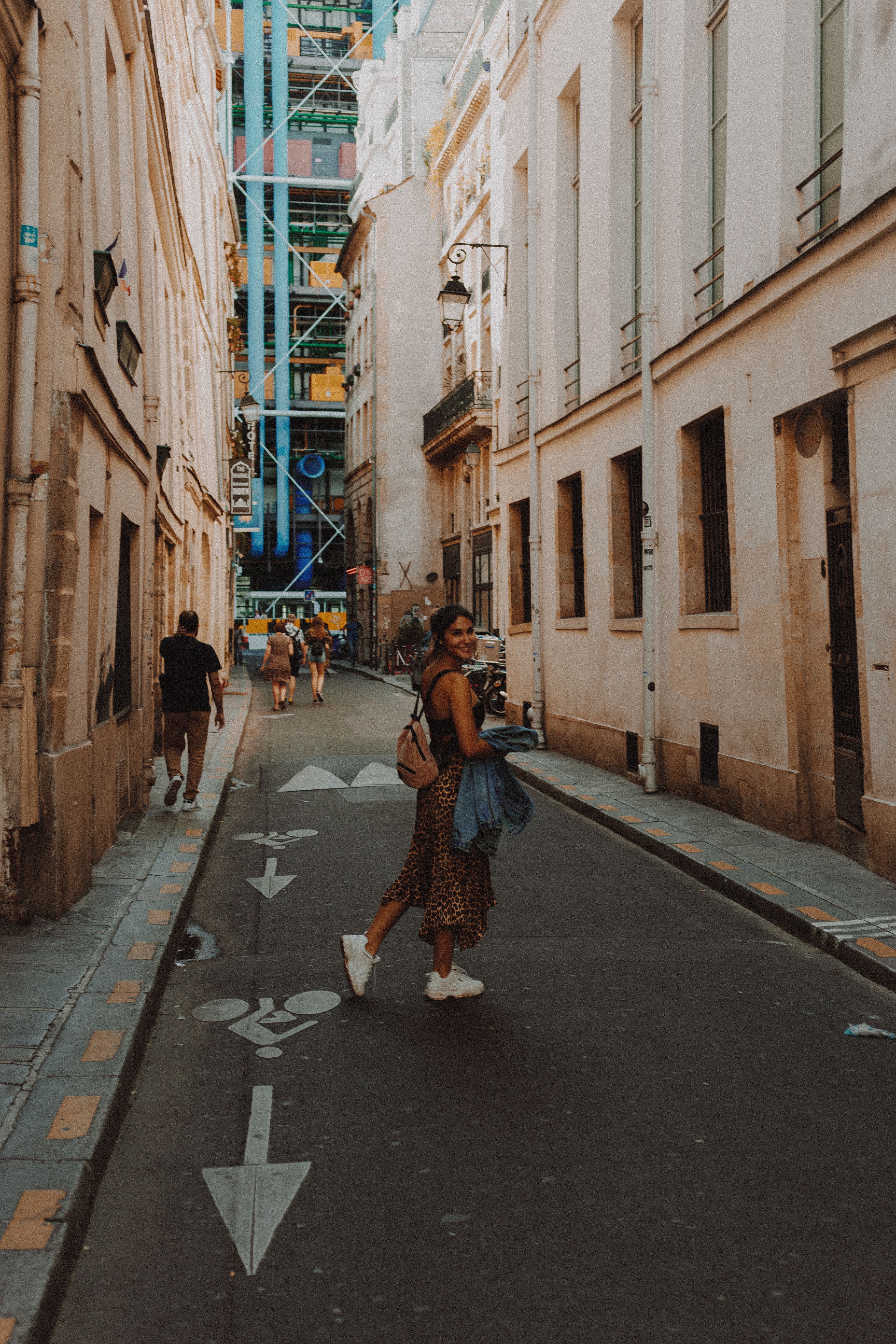 Photo Of Woman Walking On Pavement · Free Stock Photo