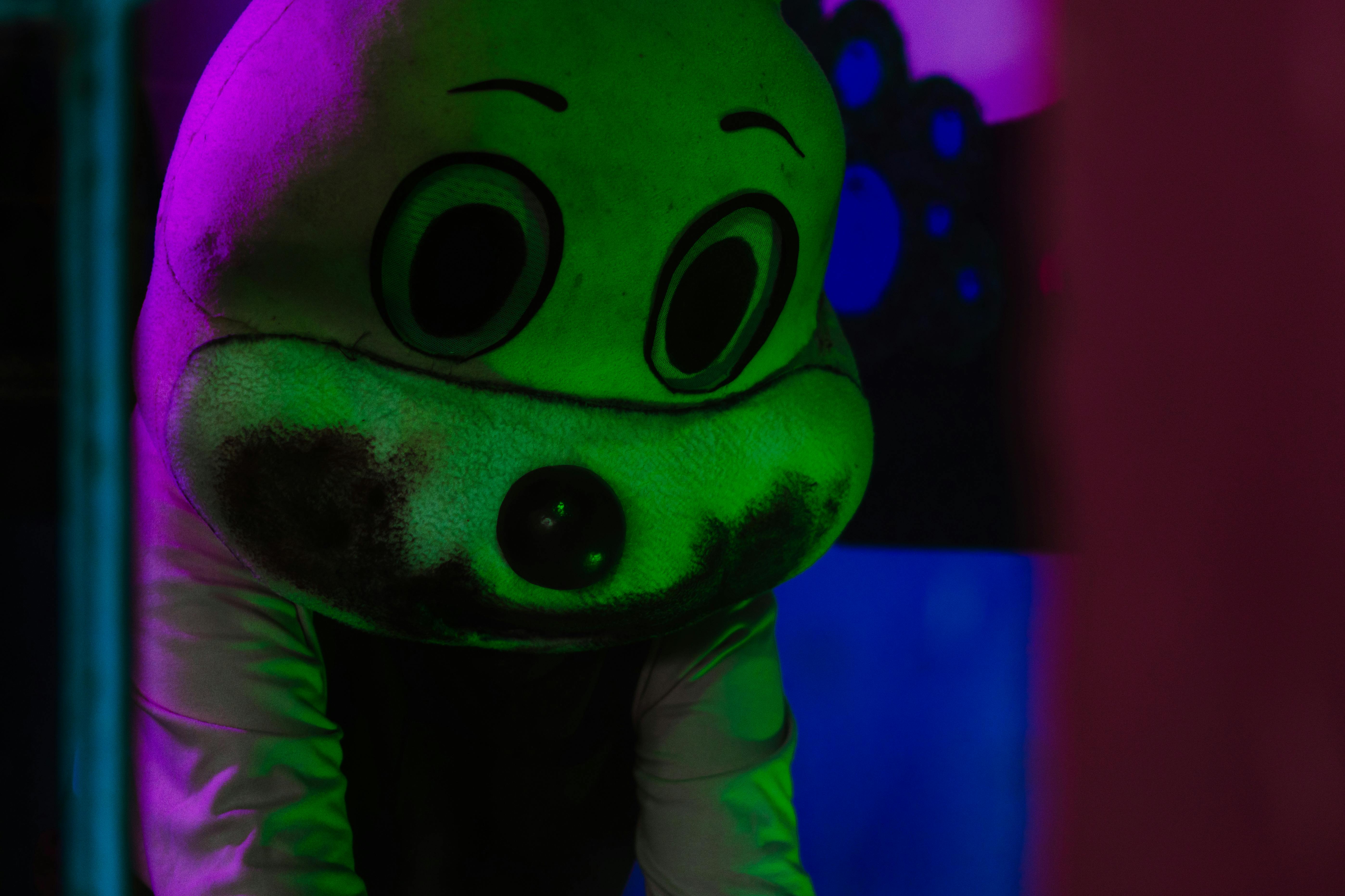 Creepy Costume in Dim Green Light at Night · Free Stock Photo