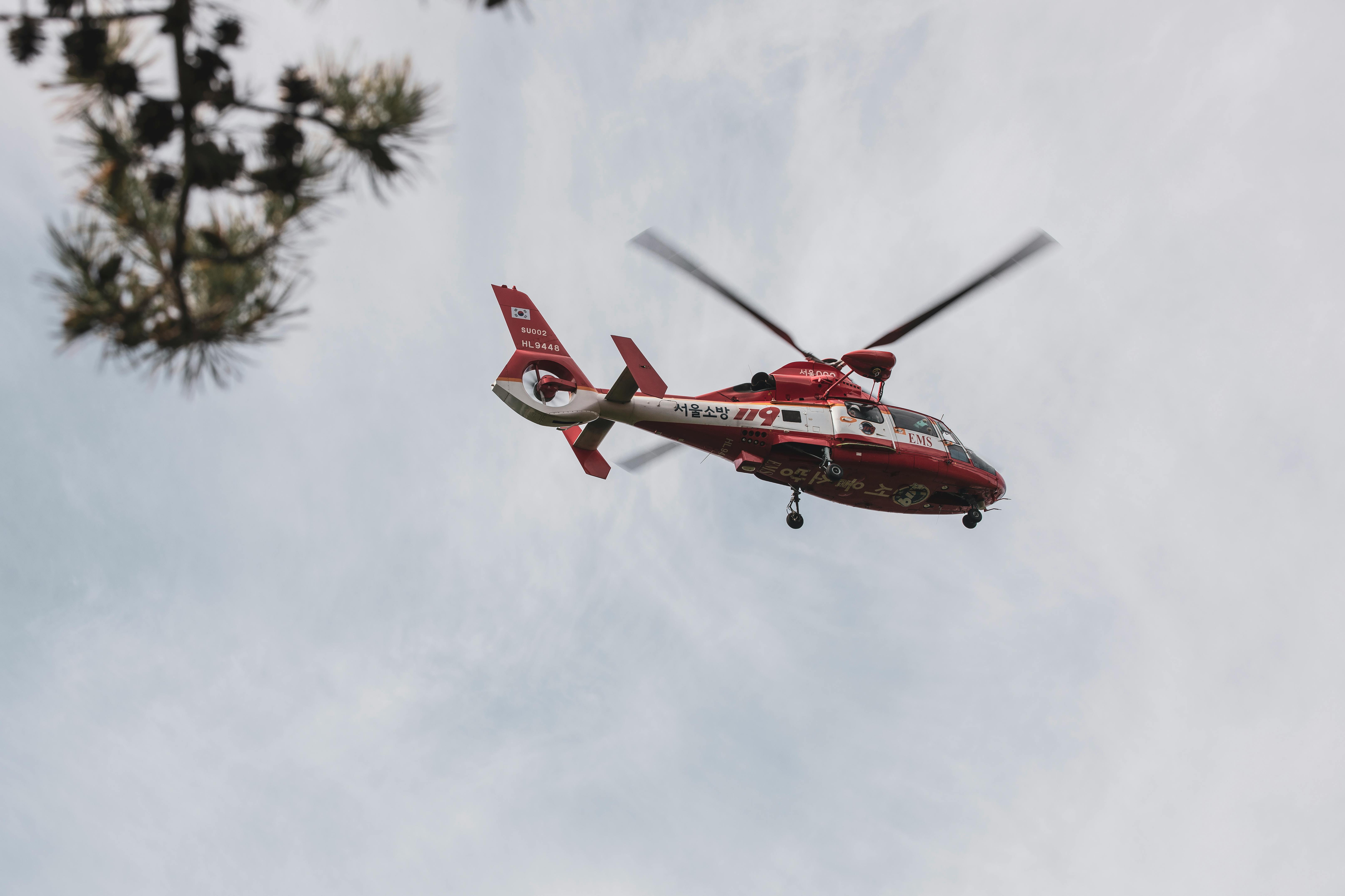 Flying Red and White Helicopter · Free Stock Photo