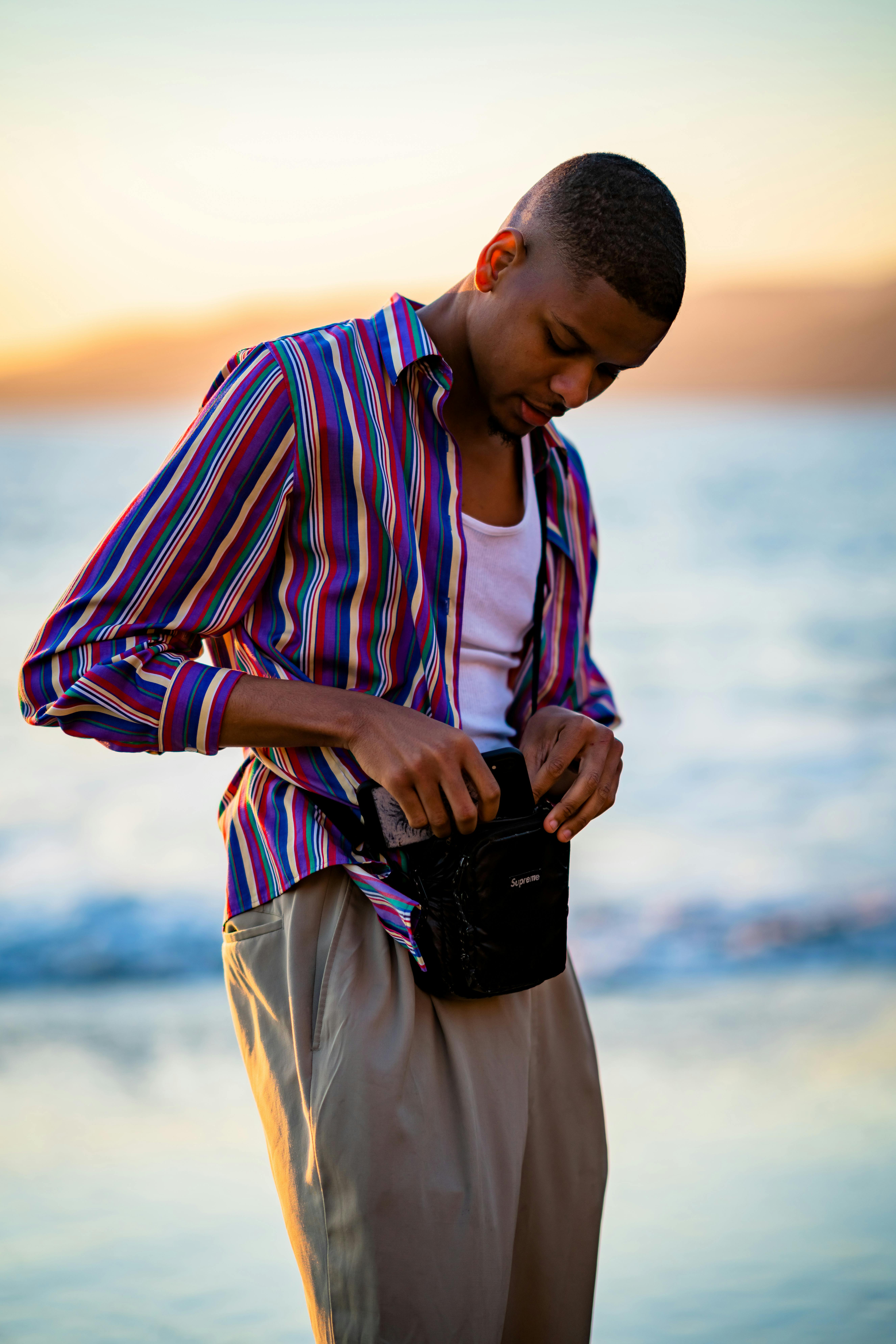 Photo Of Man Holding His Bag · Free Stock Photo