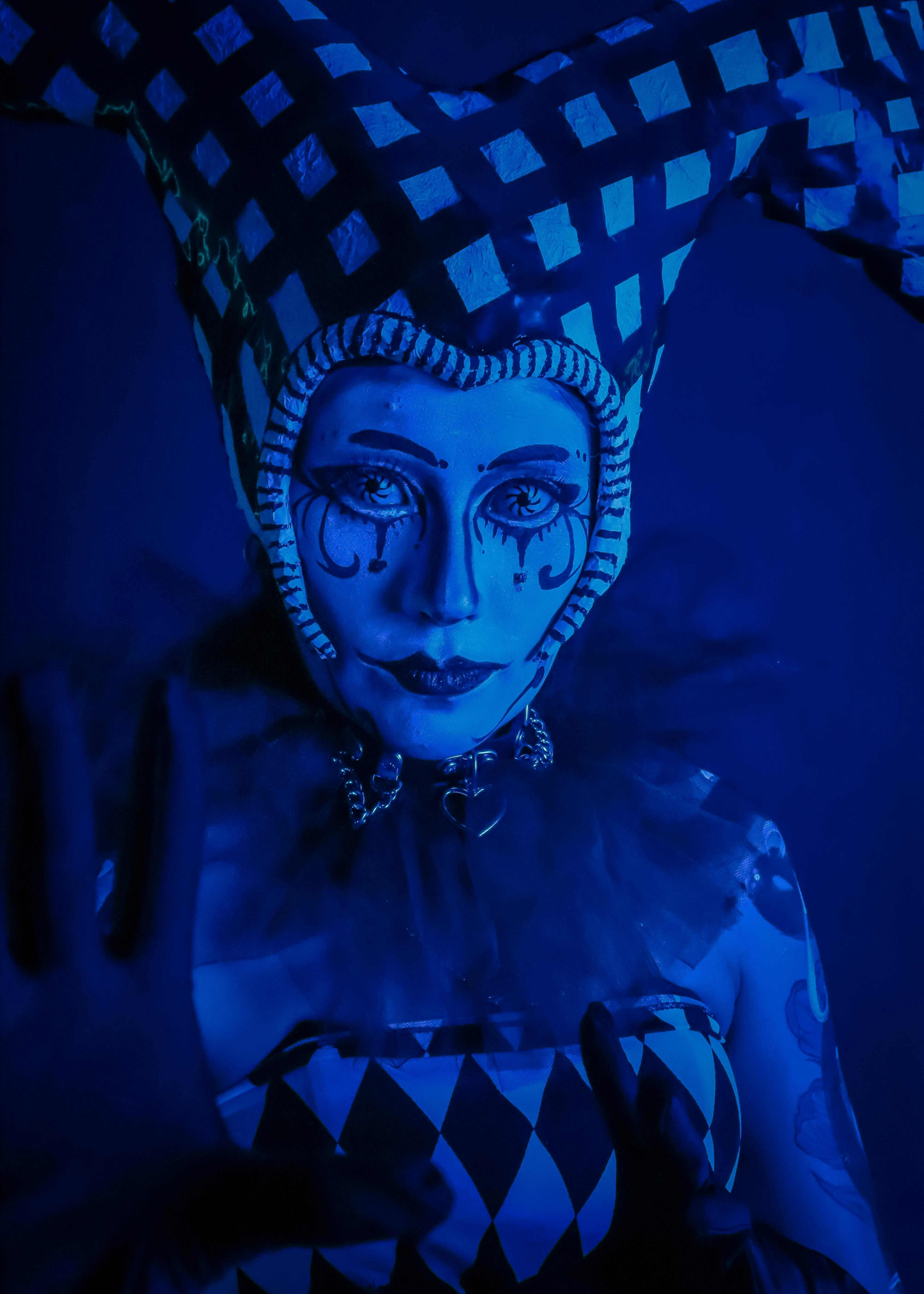 Mystical Jester in Dark Blue Lighting · Free Stock Photo
