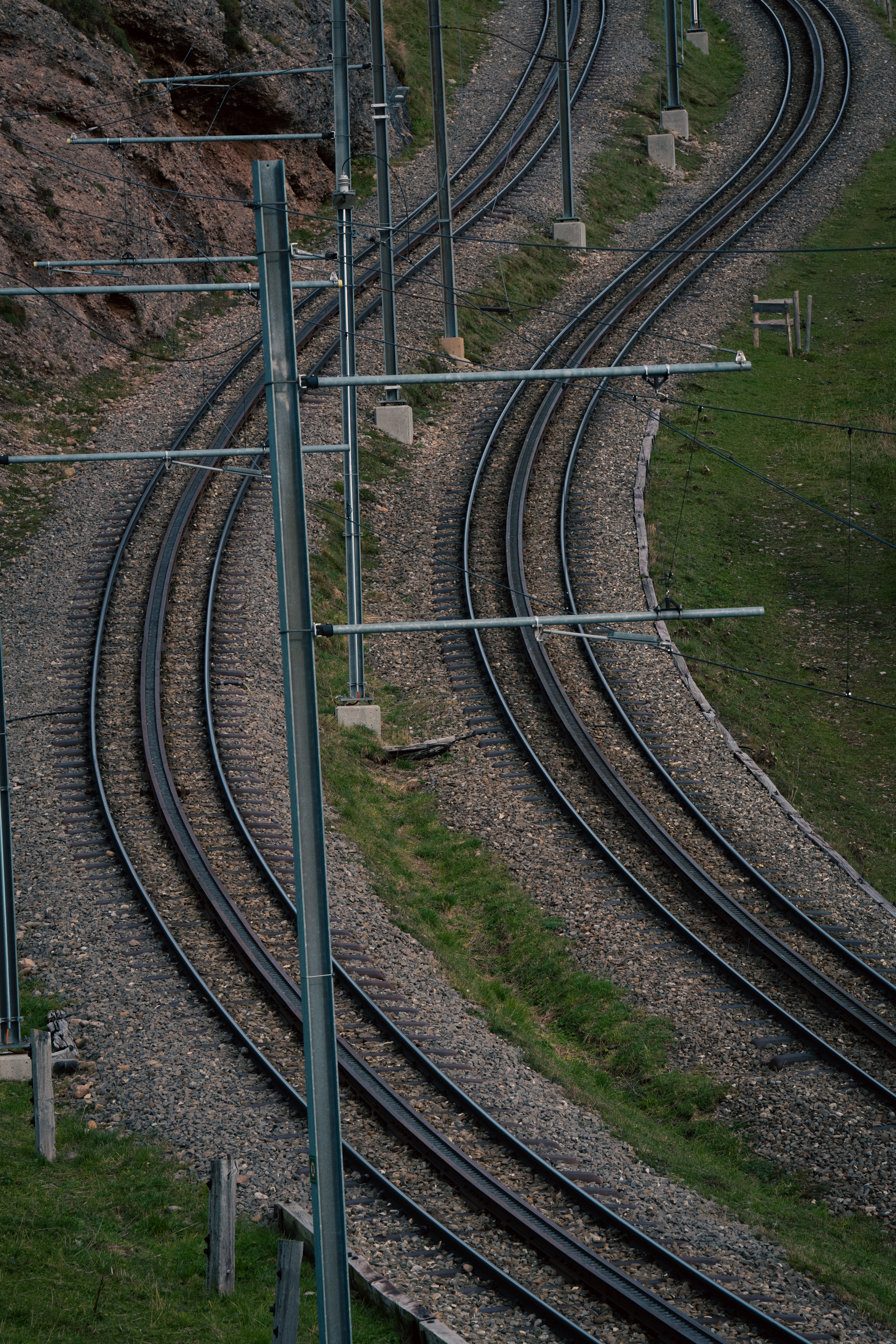 Curved Railroad Tracks in Scenic Outdoor Setting · Free Stock Photo