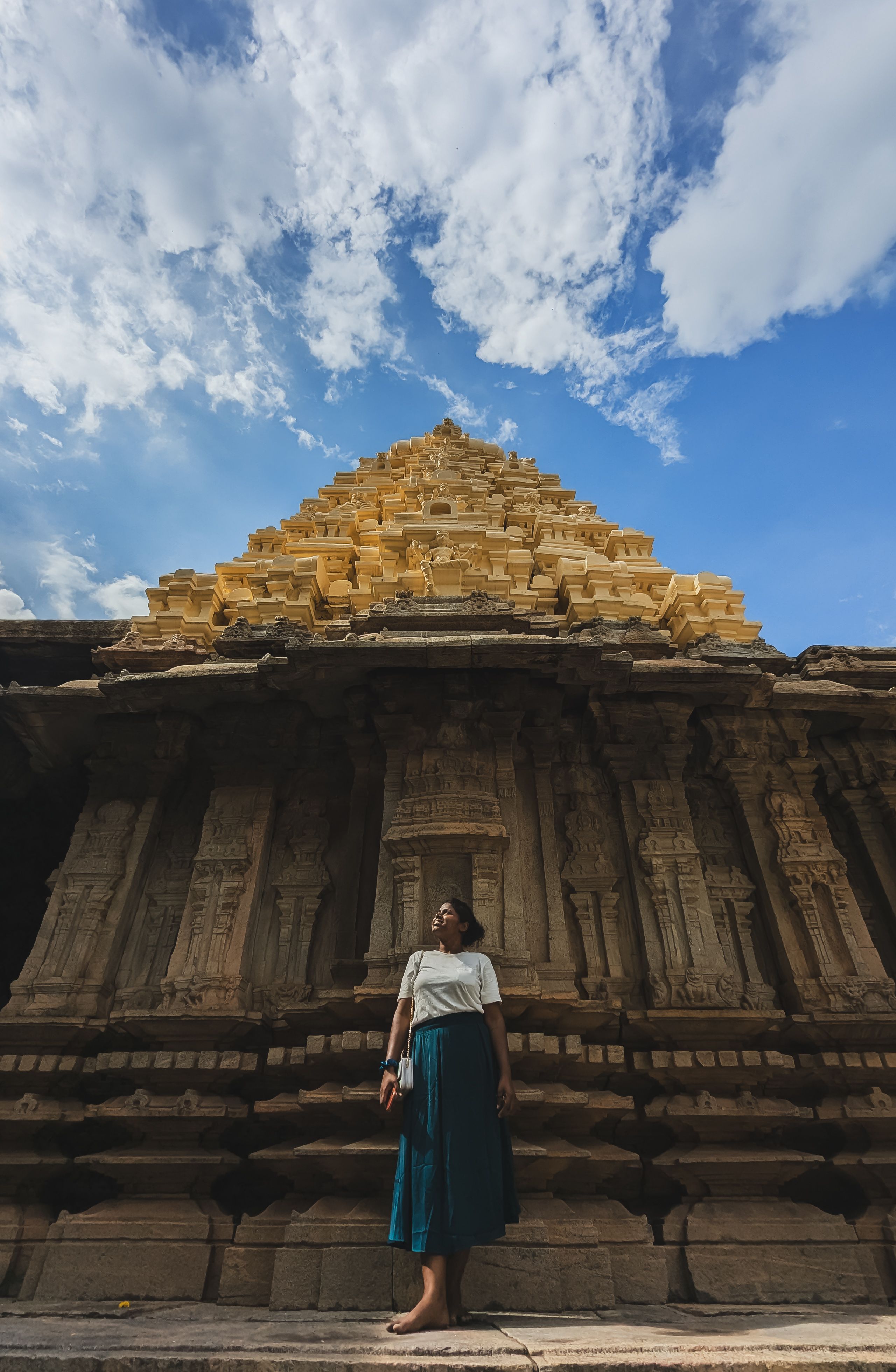 Woman Standing at Ancient Temple with Dramatic Sky · Free Stock Photo
