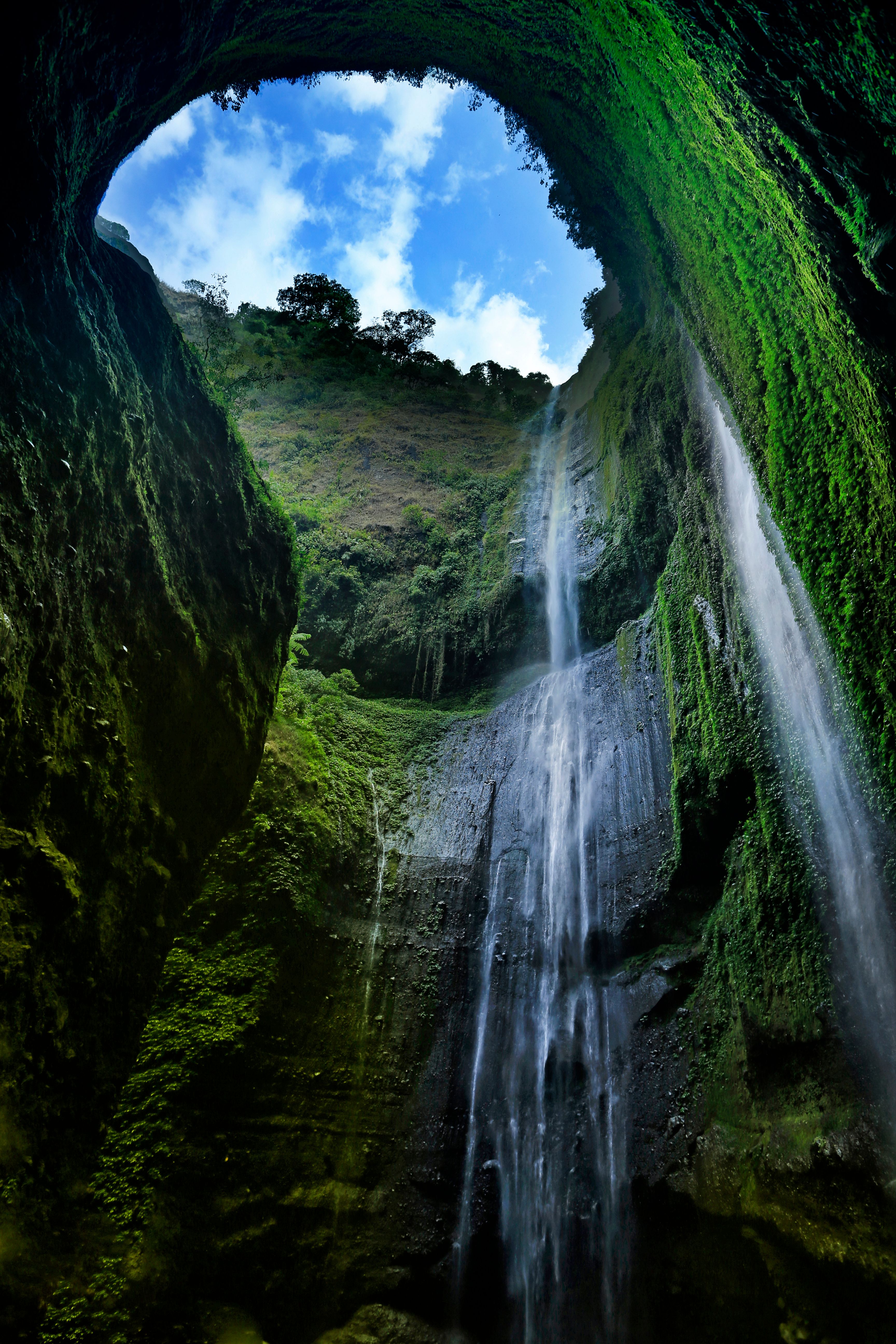 Dramatic Waterfall Cascading in Cave Formation · Free Stock Photo
