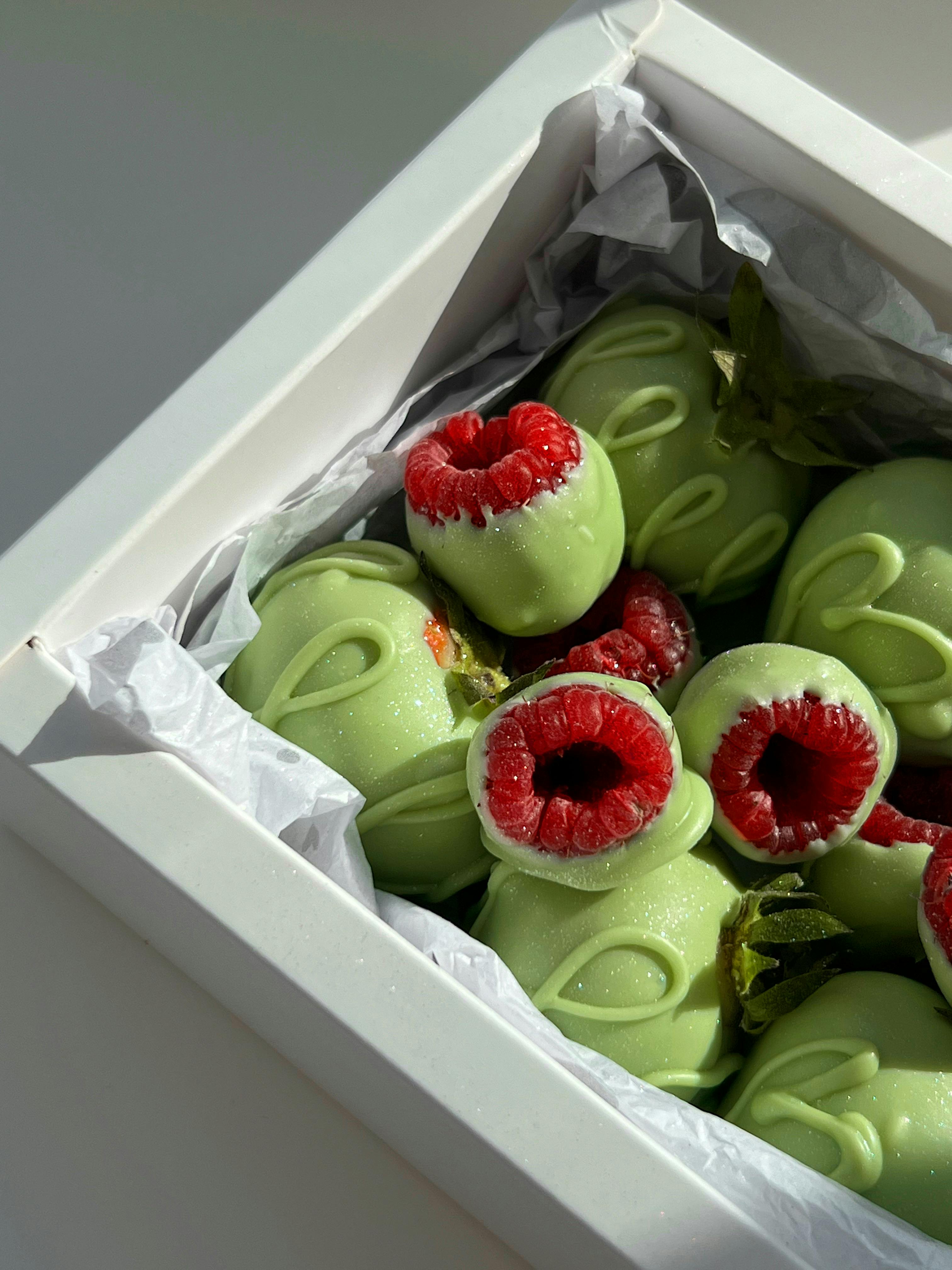 Assorted Fruit in Honeydew Chocolate Box Display · Free Stock Photo