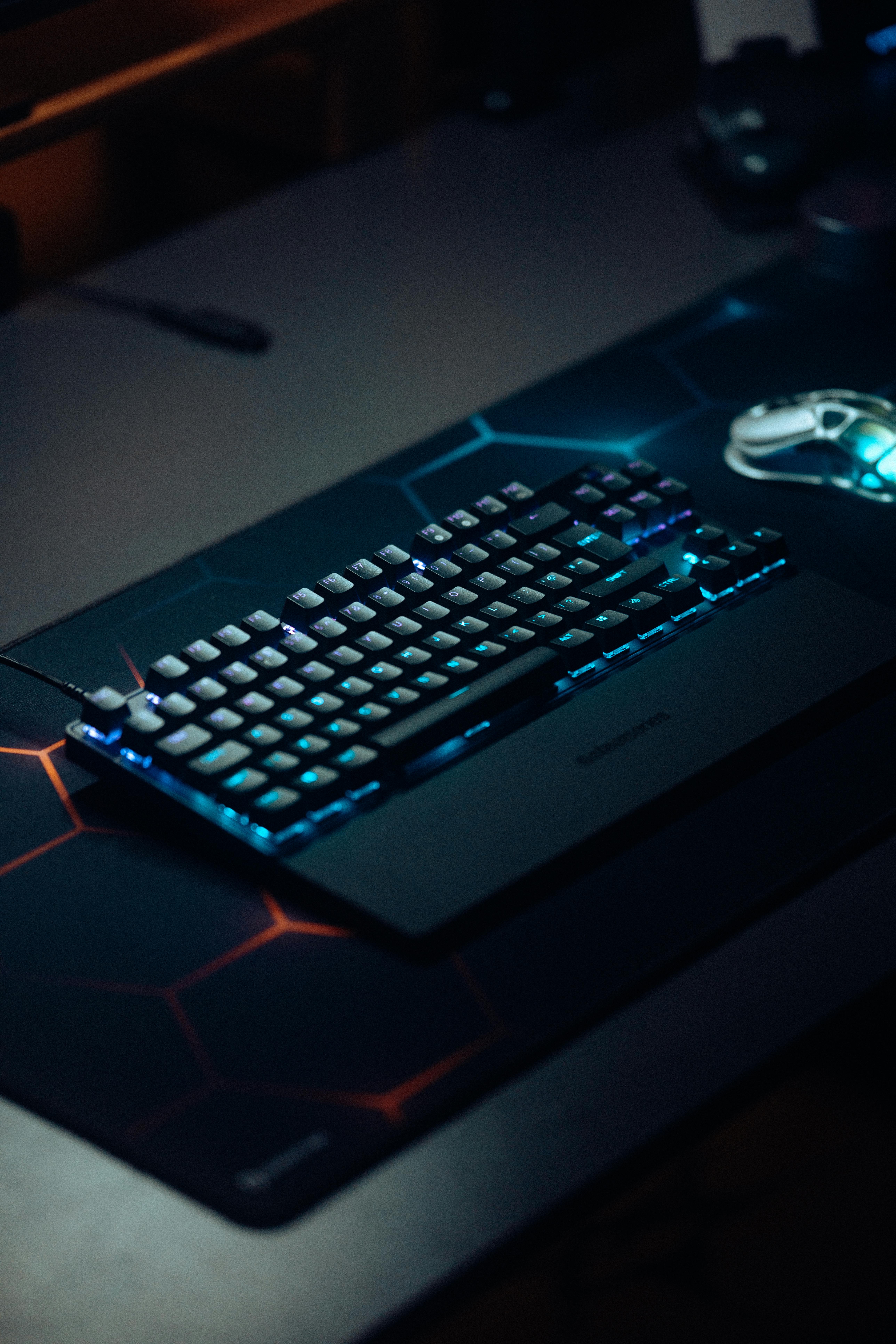 Mechanical Keyboard with RGB Lighting on Gaming Setup · Free Stock Photo