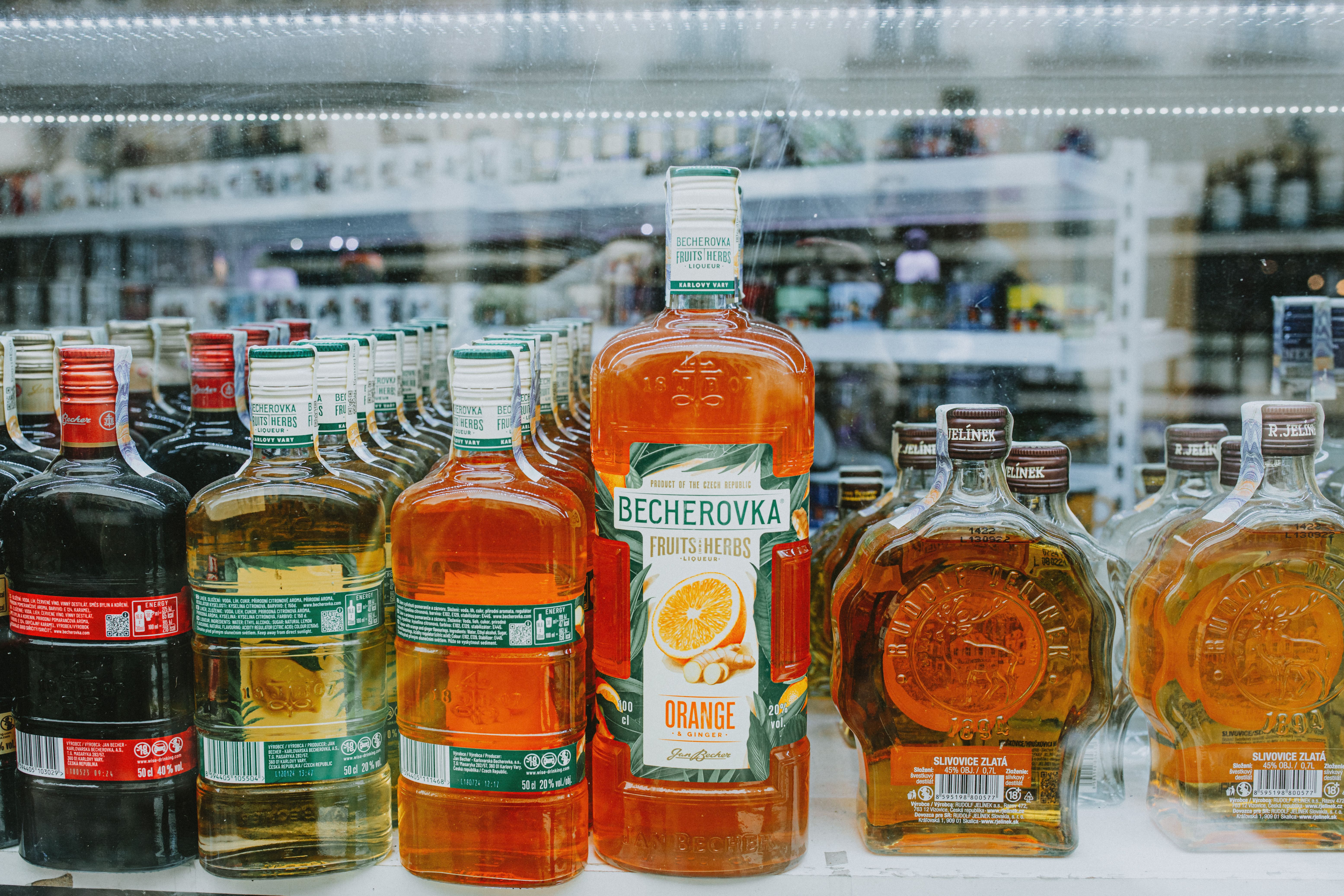 Colorful Assortment of Liquor Bottles in Store · Free Stock Photo