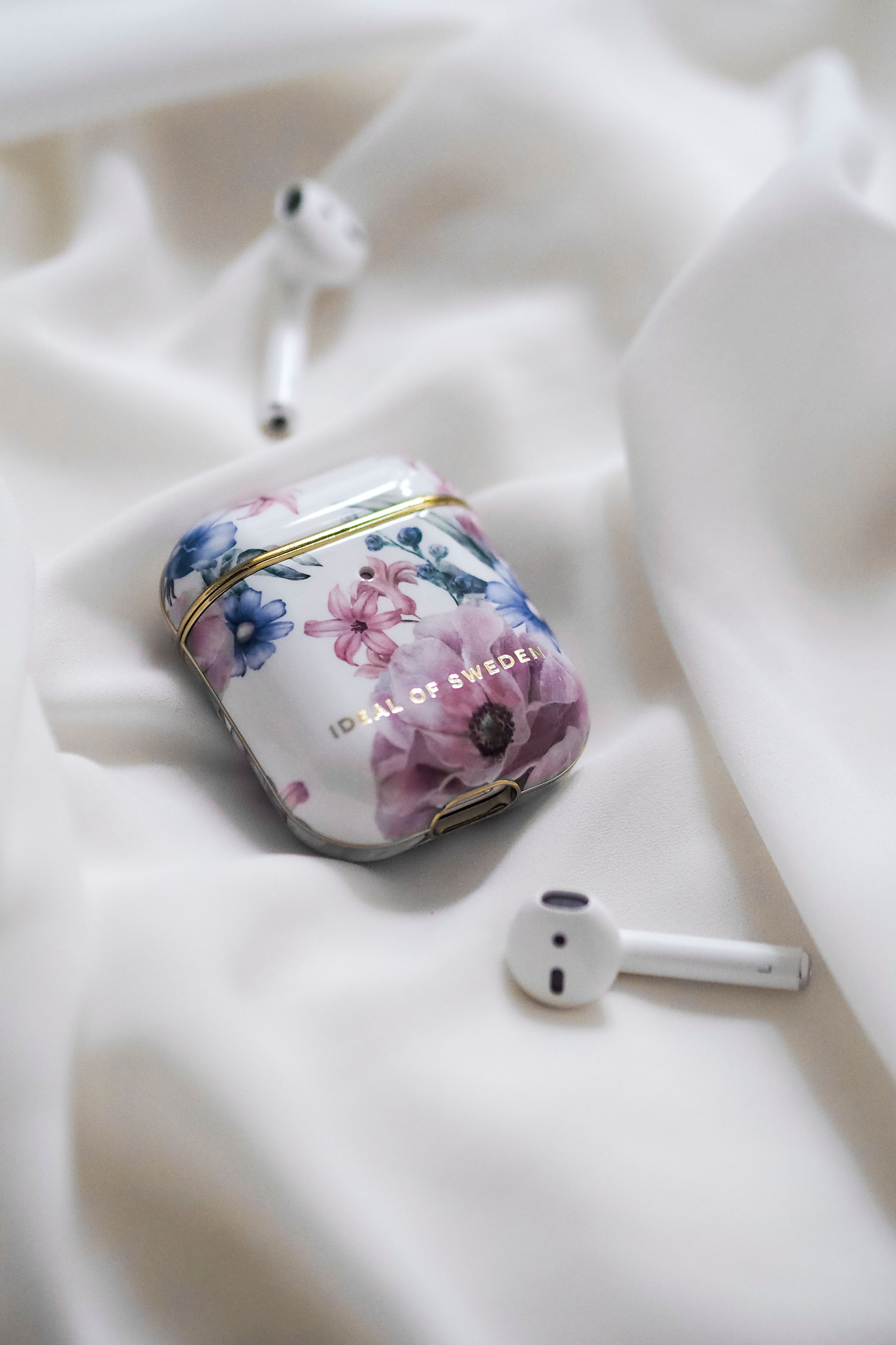 Stylish Floral Earphone Case and AirPods · Free Stock Photo