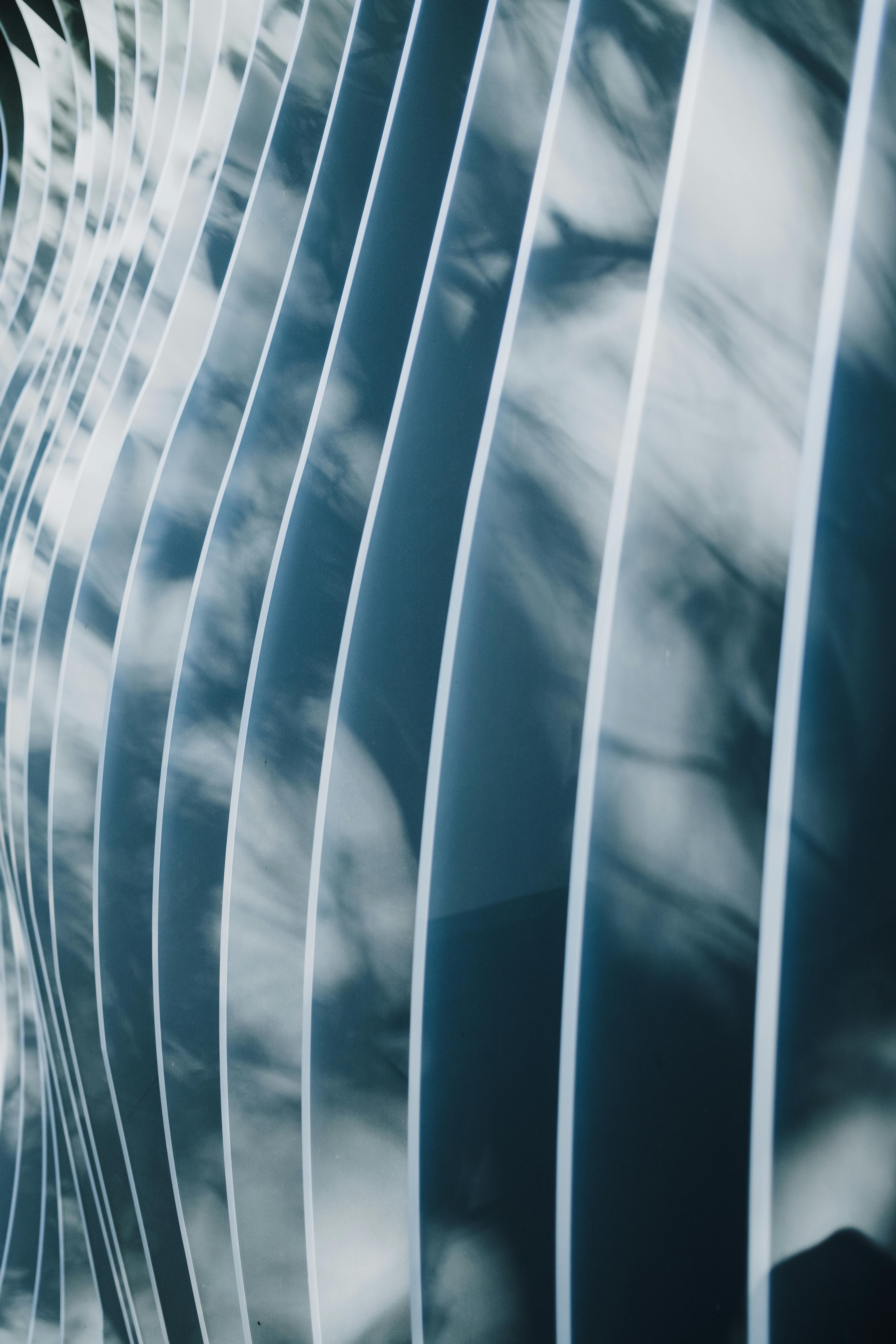 Abstract Shadows on Curved White Panels · Free Stock Photo