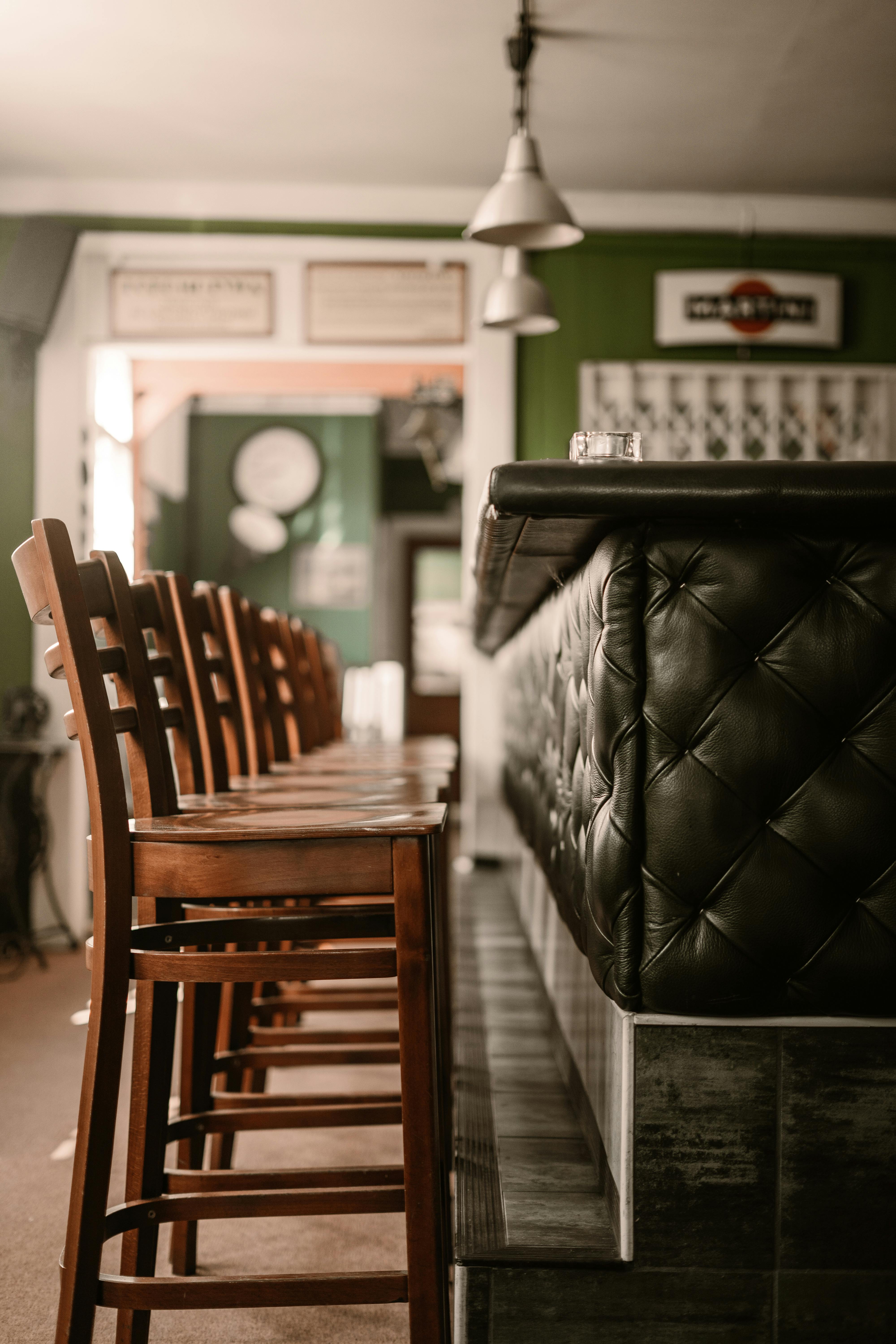 Vintage Bar Interior with Wooden Seating · Free Stock Photo