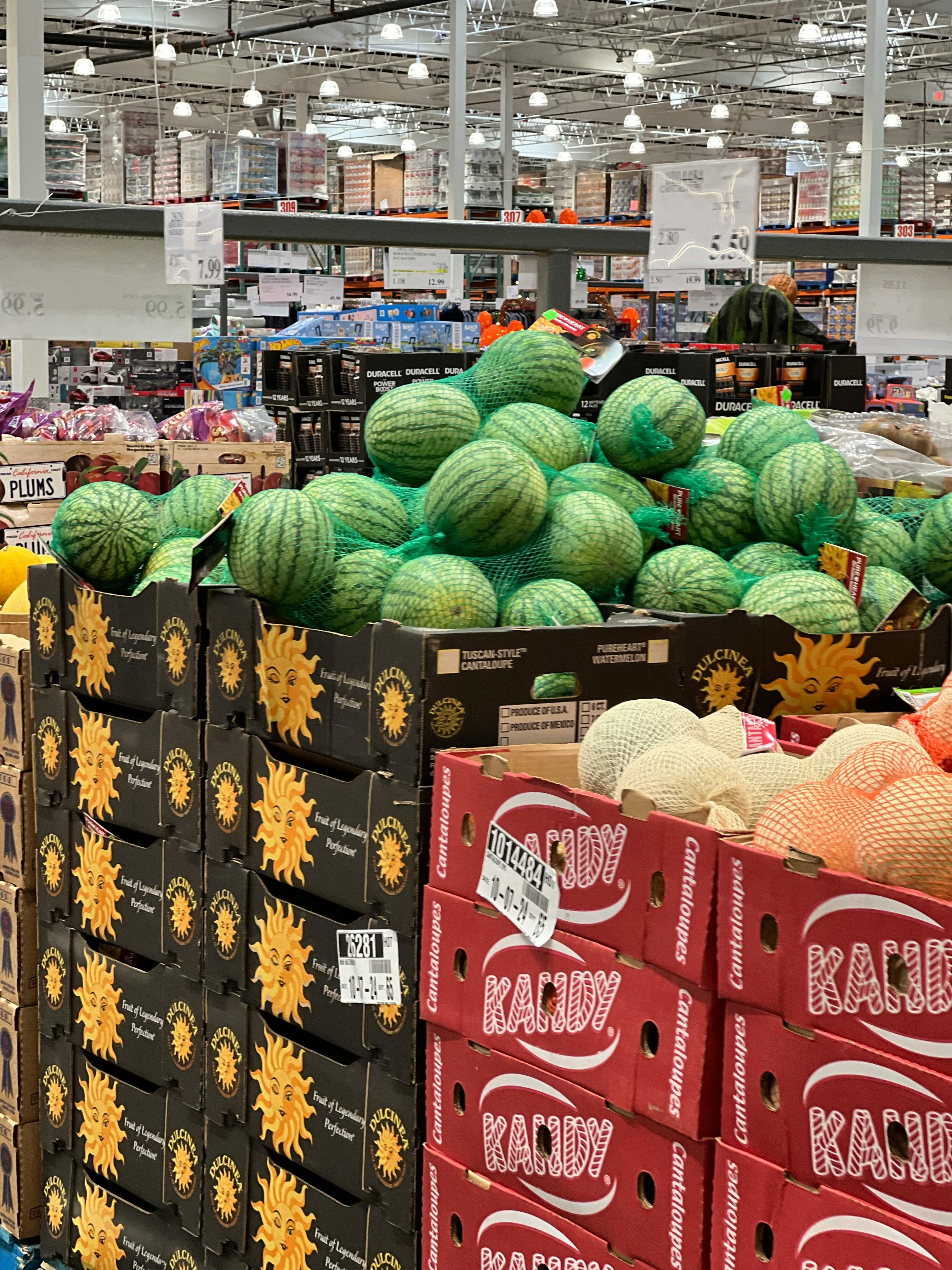 Vibrant Watermelon Display in Grocery Store · Free Stock Photo