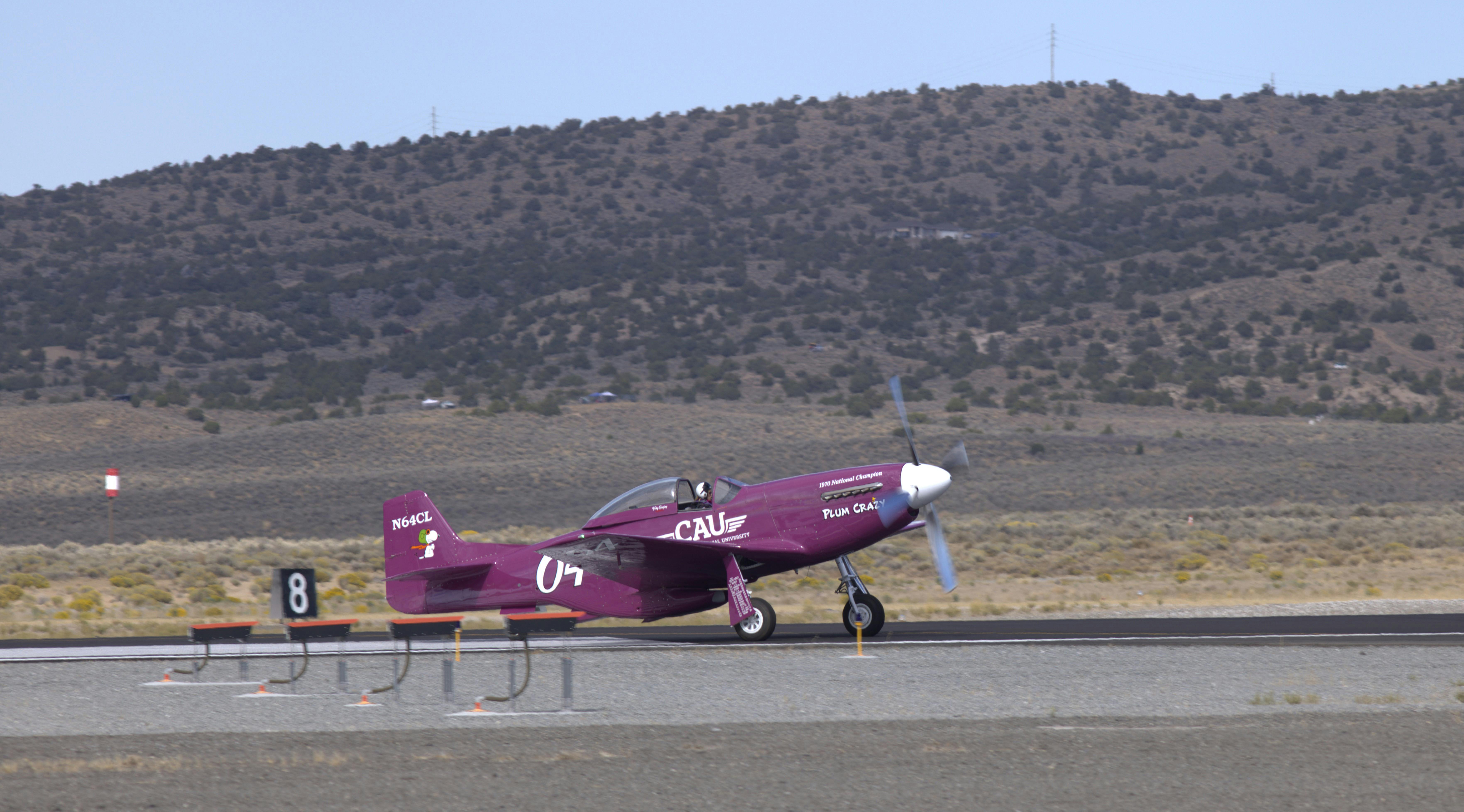 Vintage Airplane Racing in Desert Landscape · Free Stock Photo
