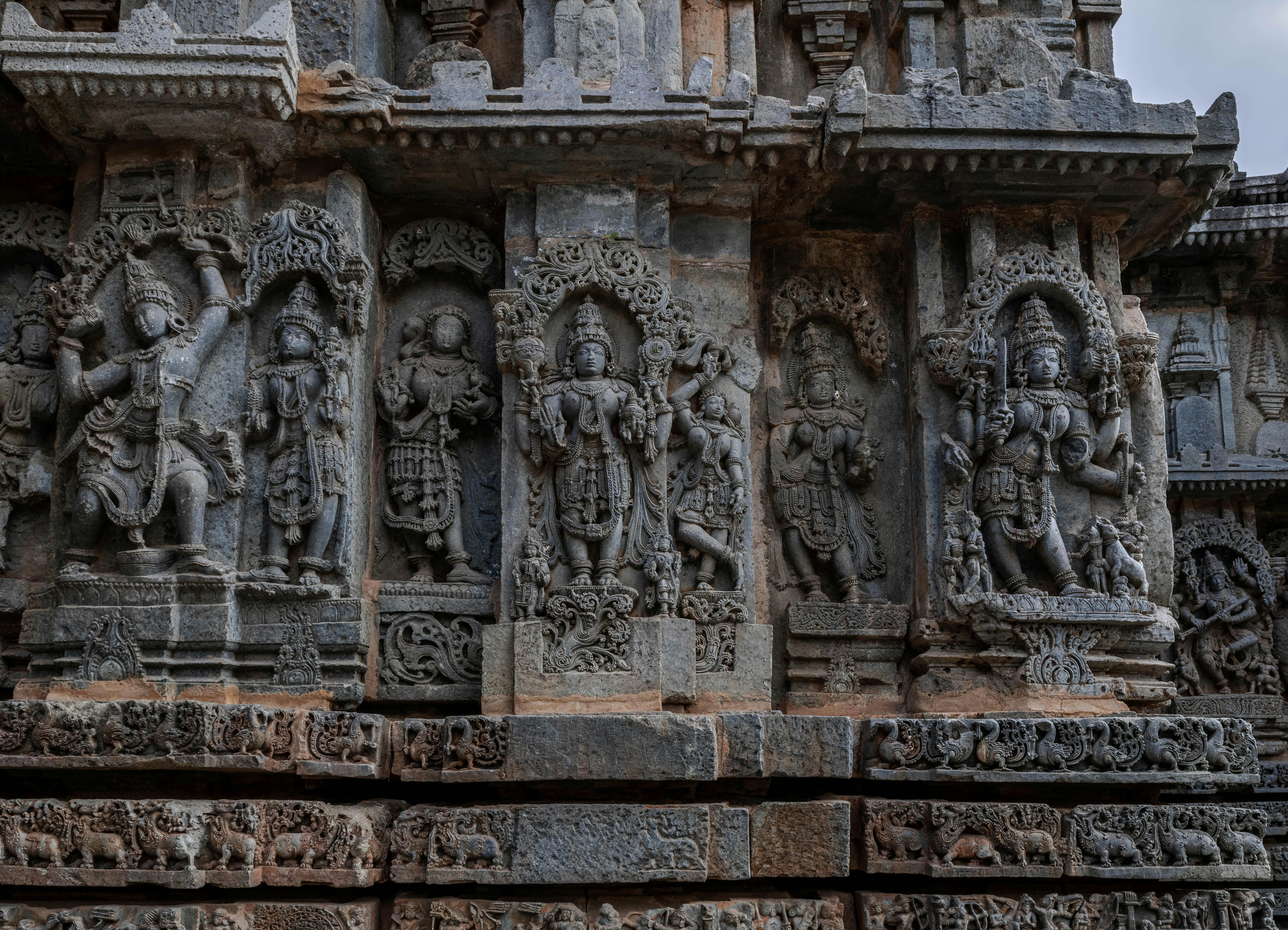 Intricate Stone Carvings on Ancient Temple Wall · Free Stock Photo