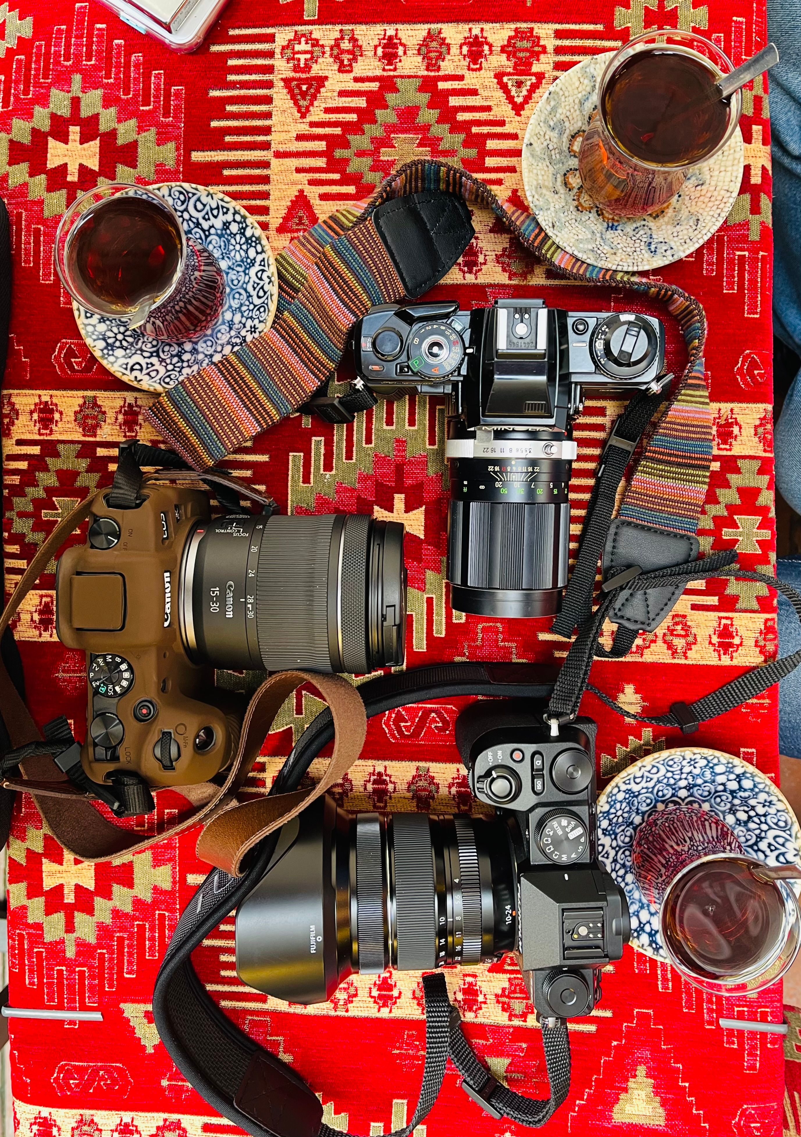 Flat Lay of Cameras and Tea on Turkish Carpet · Free Stock Photo