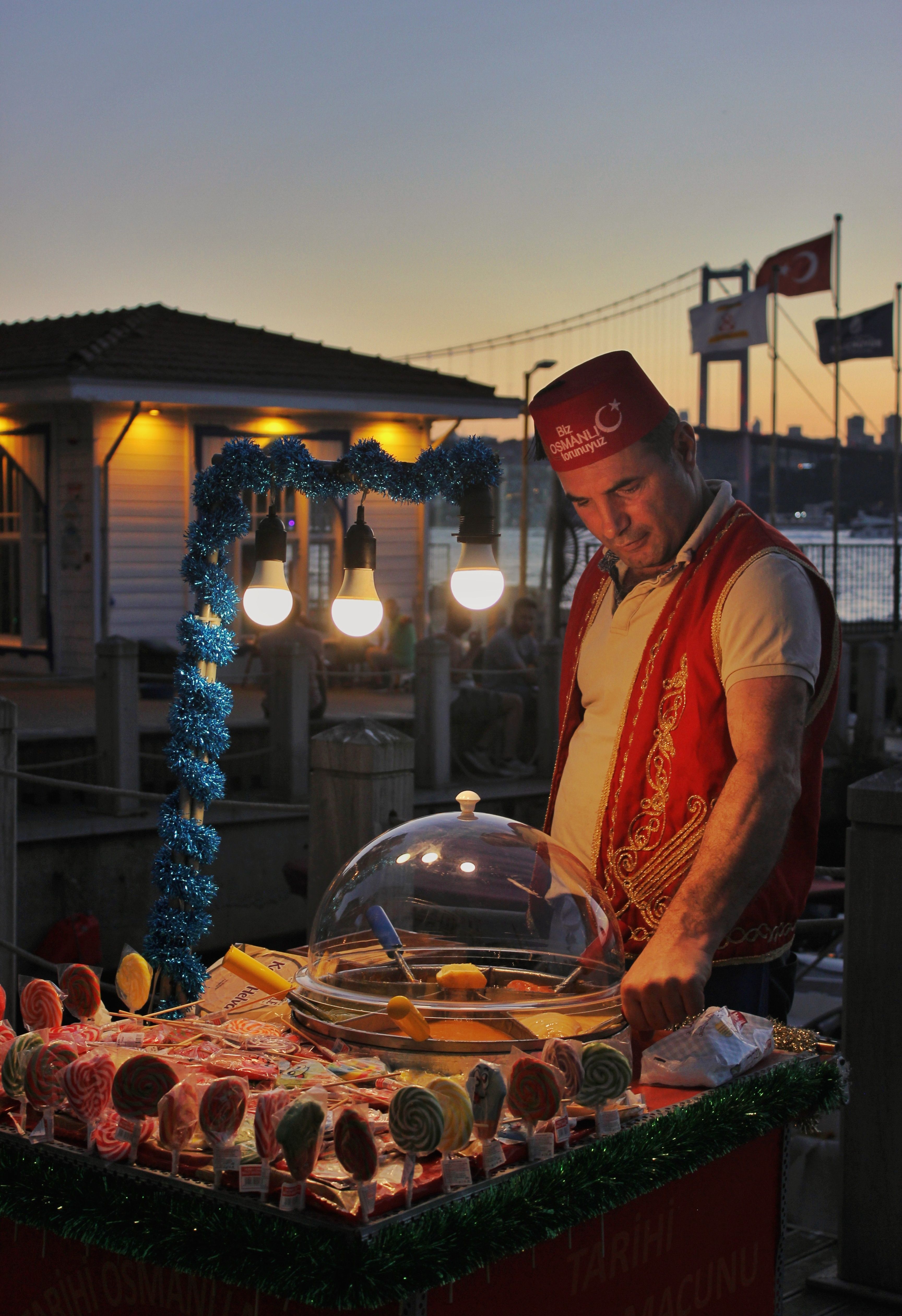 Turkish Ice Cream Vendor at Evening Market · Free Stock Photo