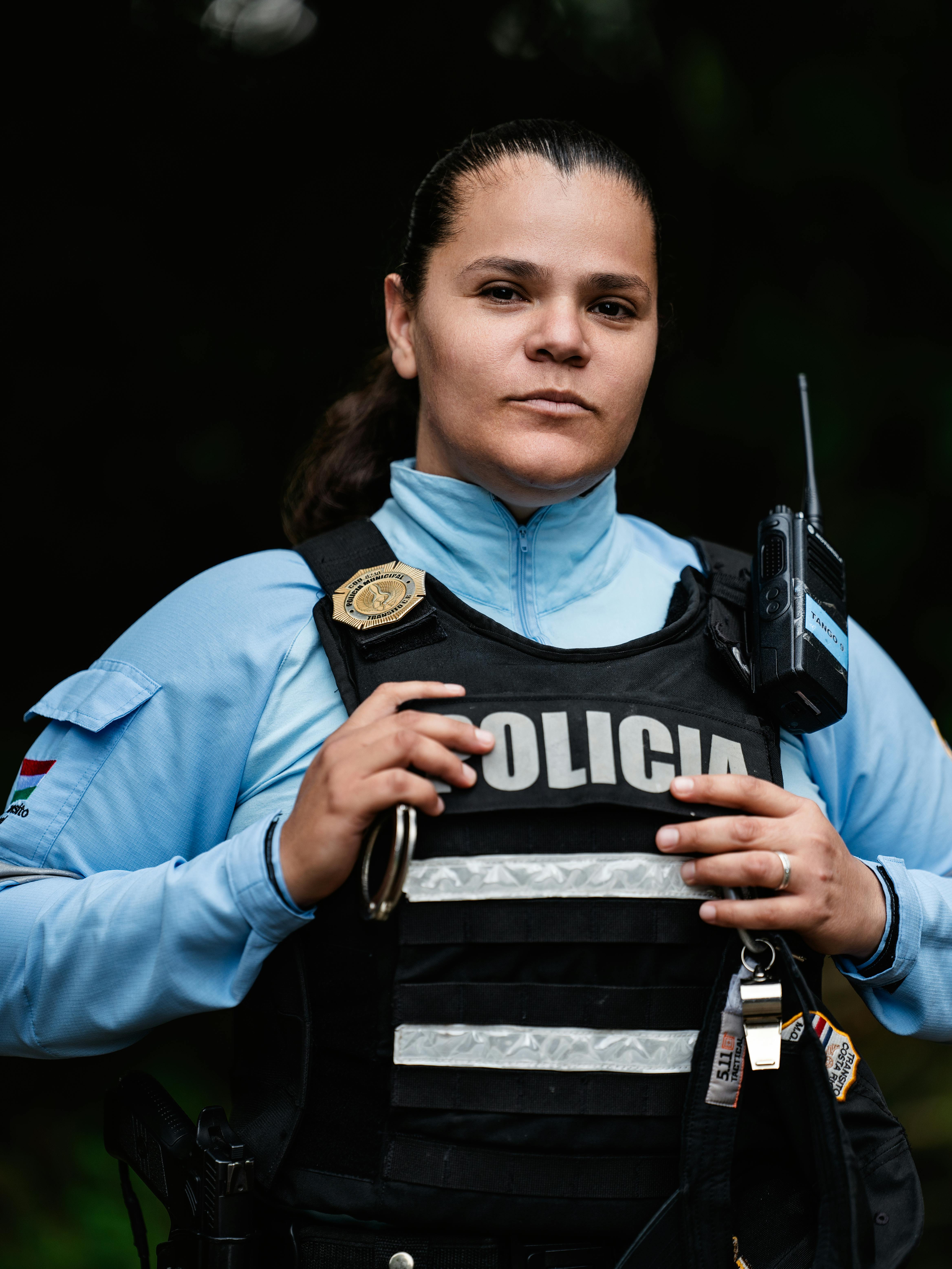 Confident Female Police Officer in Uniform Outdoors · Free Stock Photo