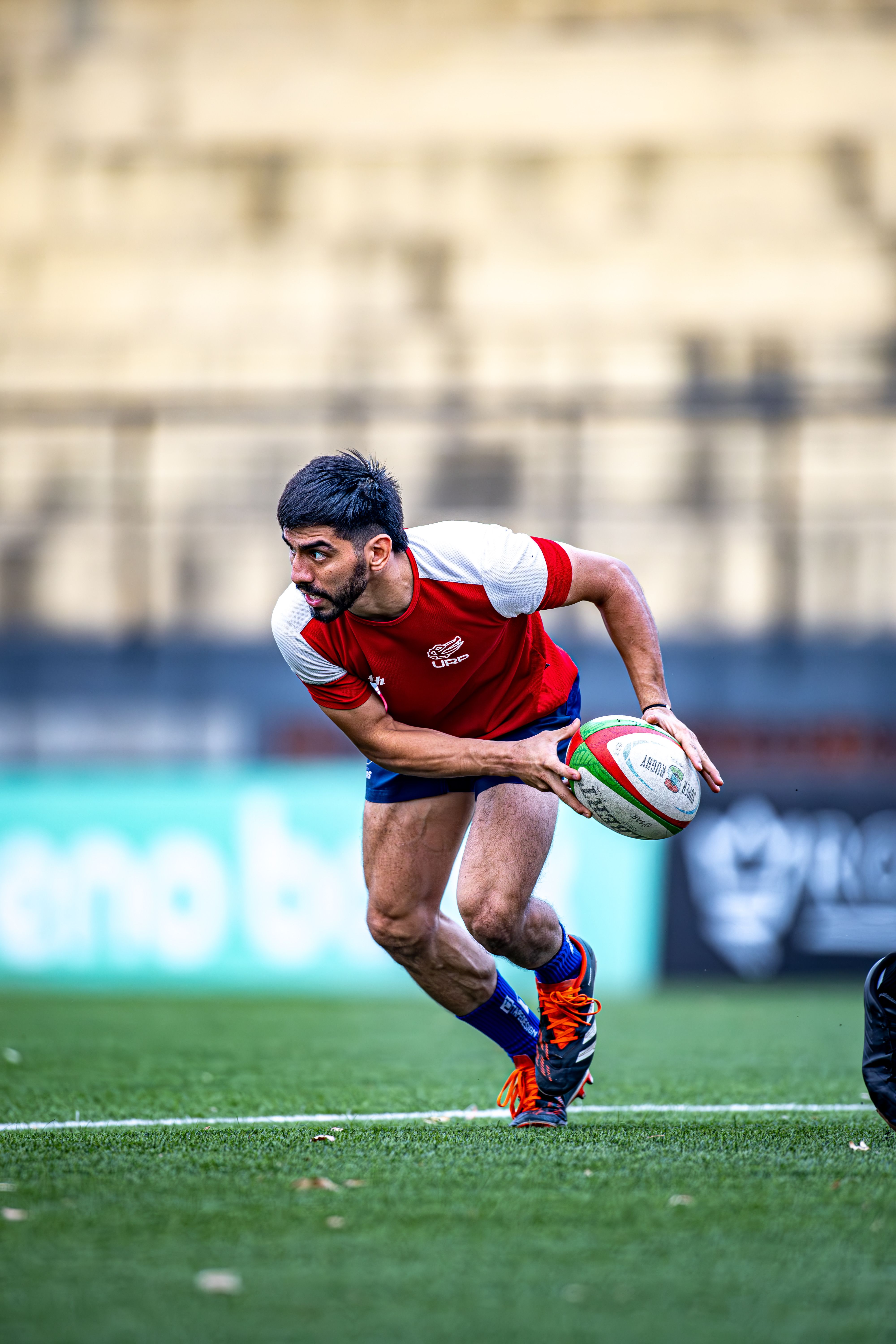 Rugby Player in Action on the Field · Free Stock Photo