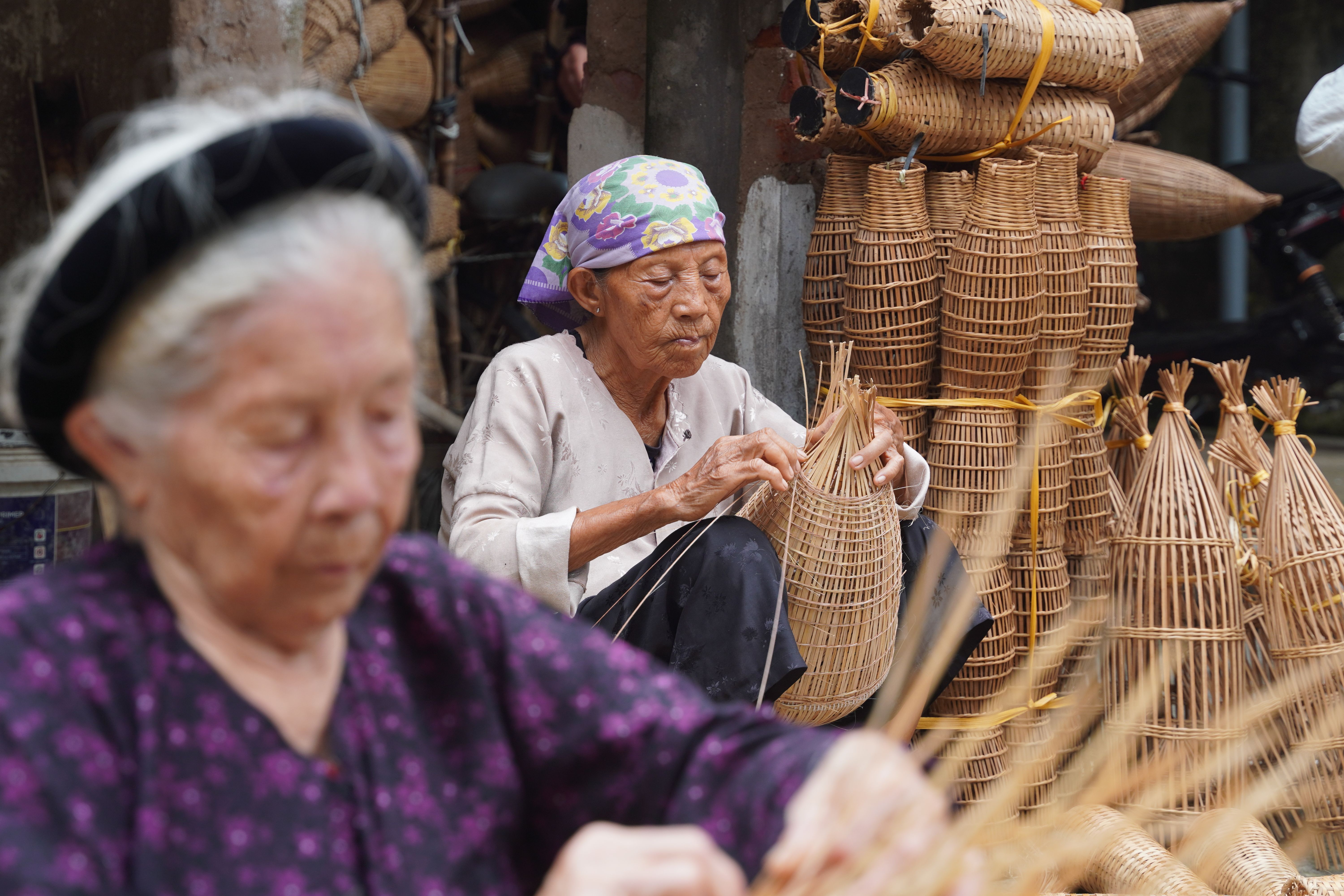 Elderly Artisans Weaving Traditional Baskets · Free Stock Photo