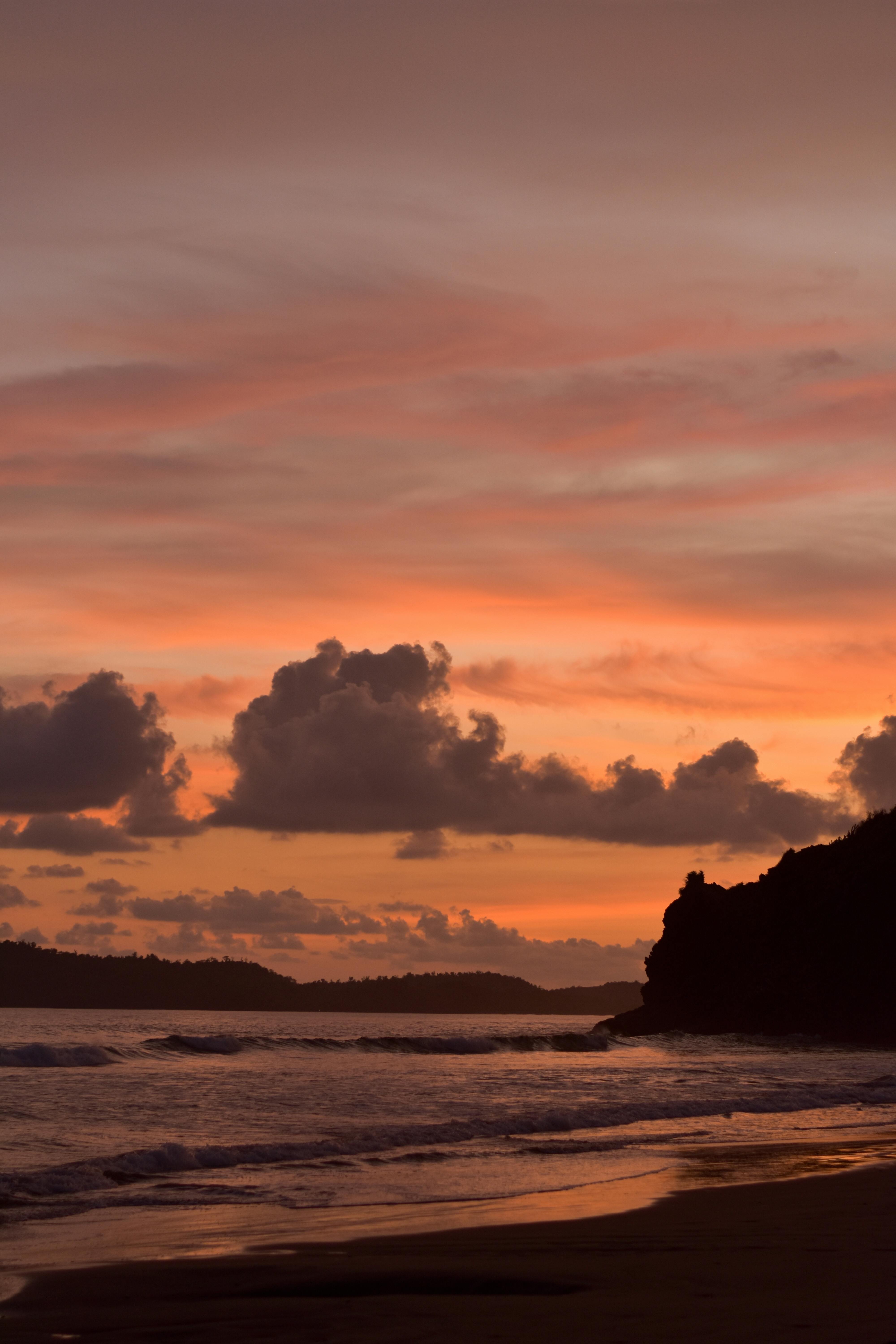 Breathtaking Beach Sunset with Dramatic Clouds · Free Stock Photo