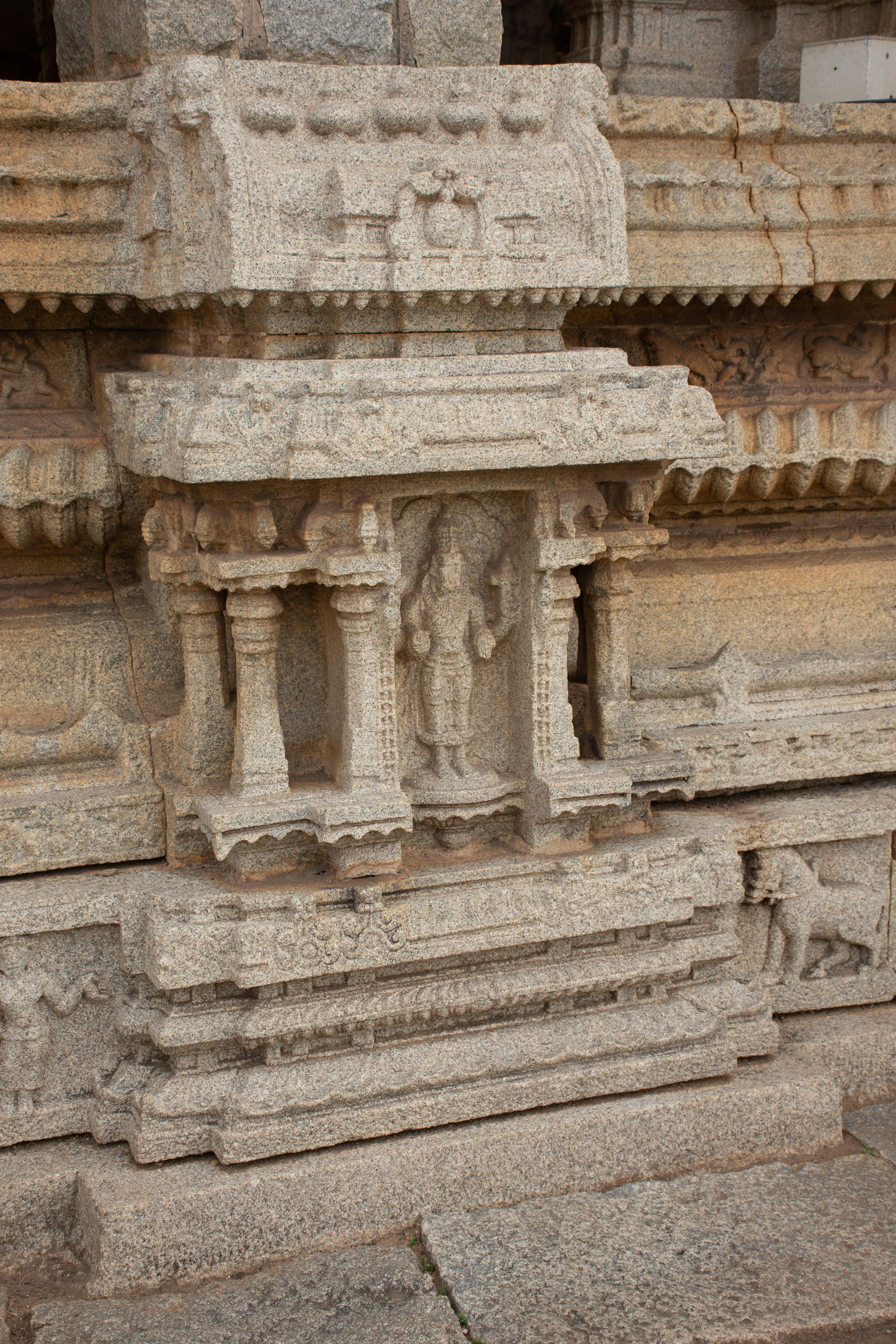 Intricate Ancient Stone Carvings on Temple Wall · Free Stock Photo
