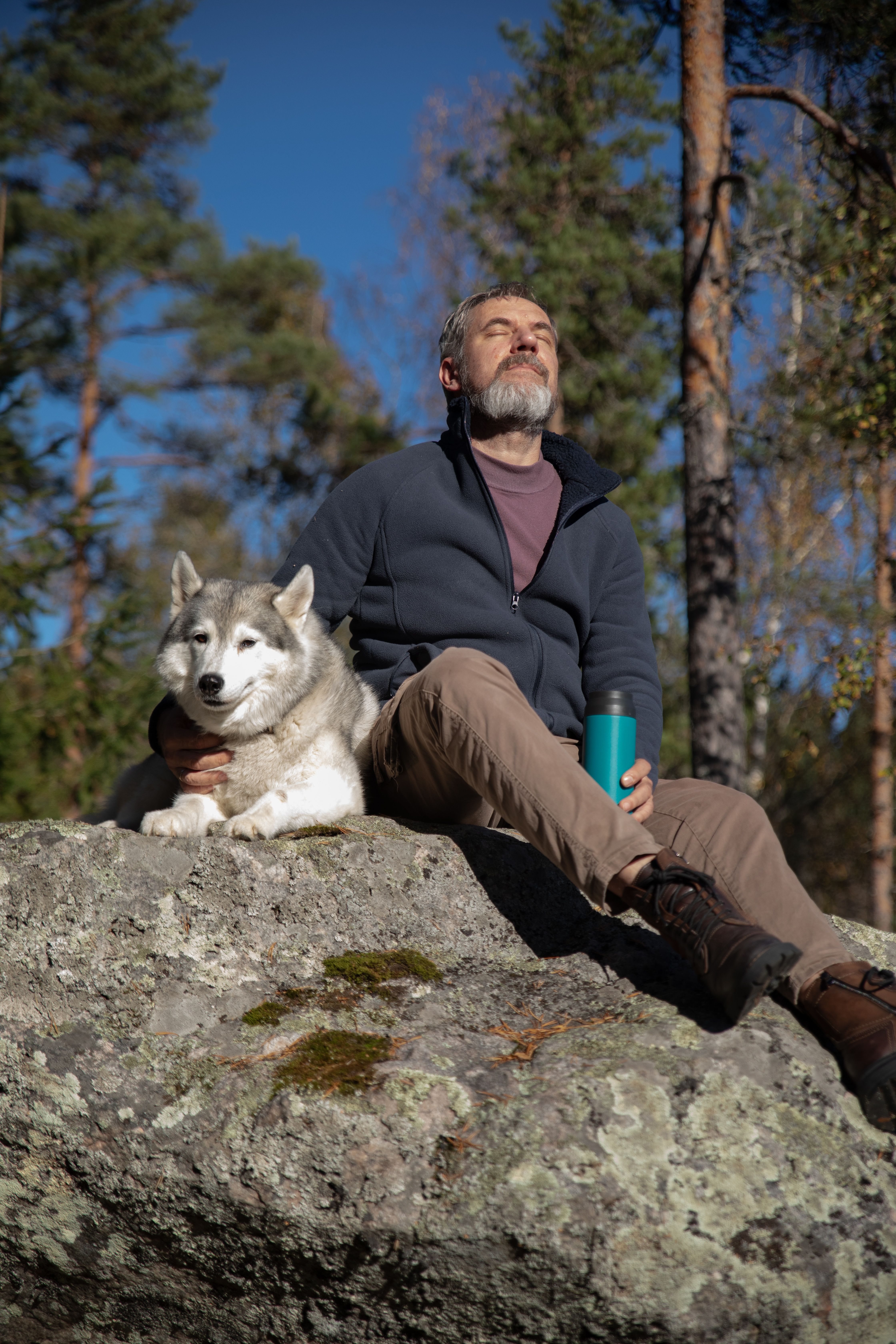 Man and Husky Enjoying Nature Outdoors · Free Stock Photo