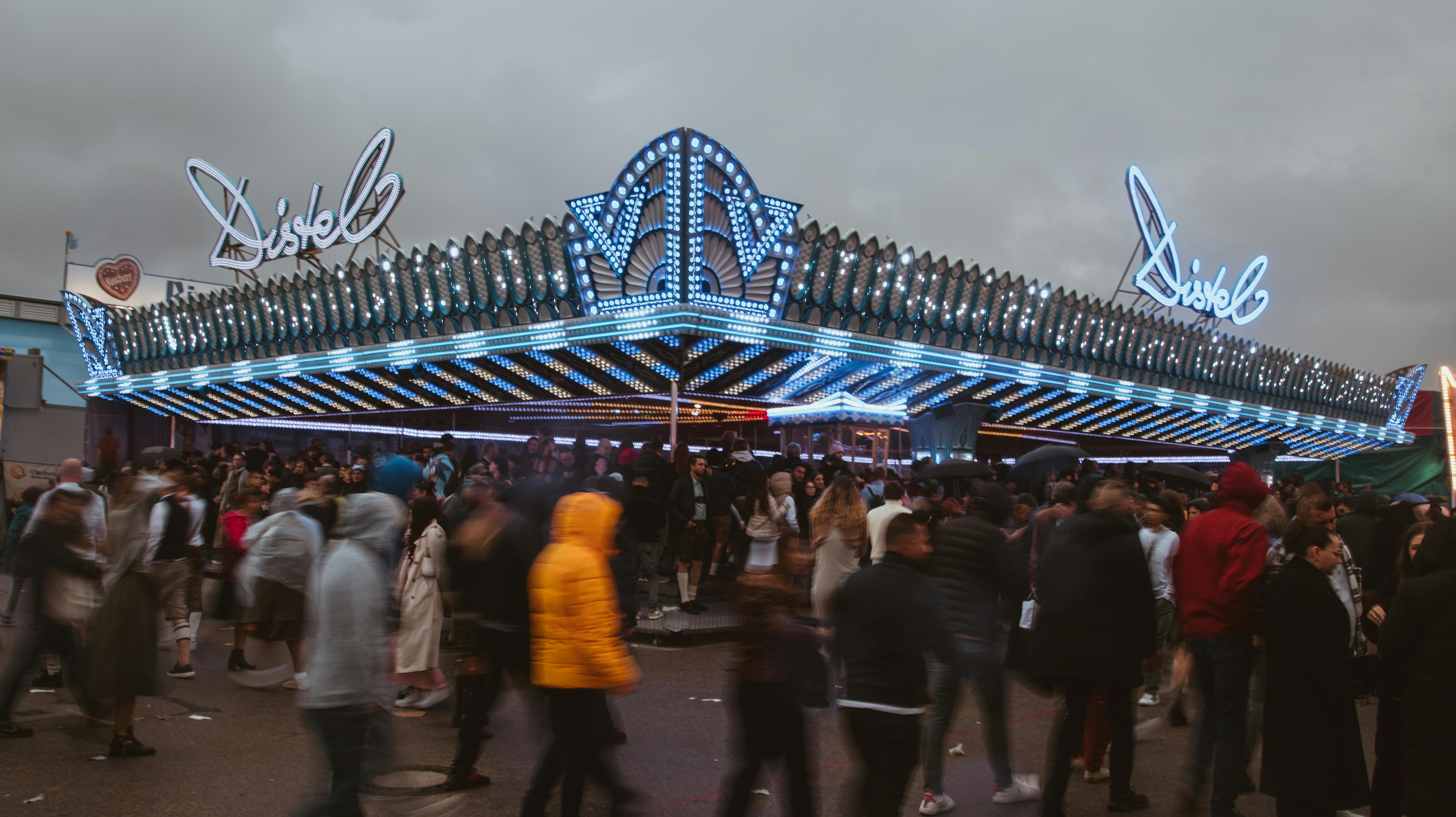 Crowded Night at Festive Carnival with Neon Lights · Free Stock Photo
