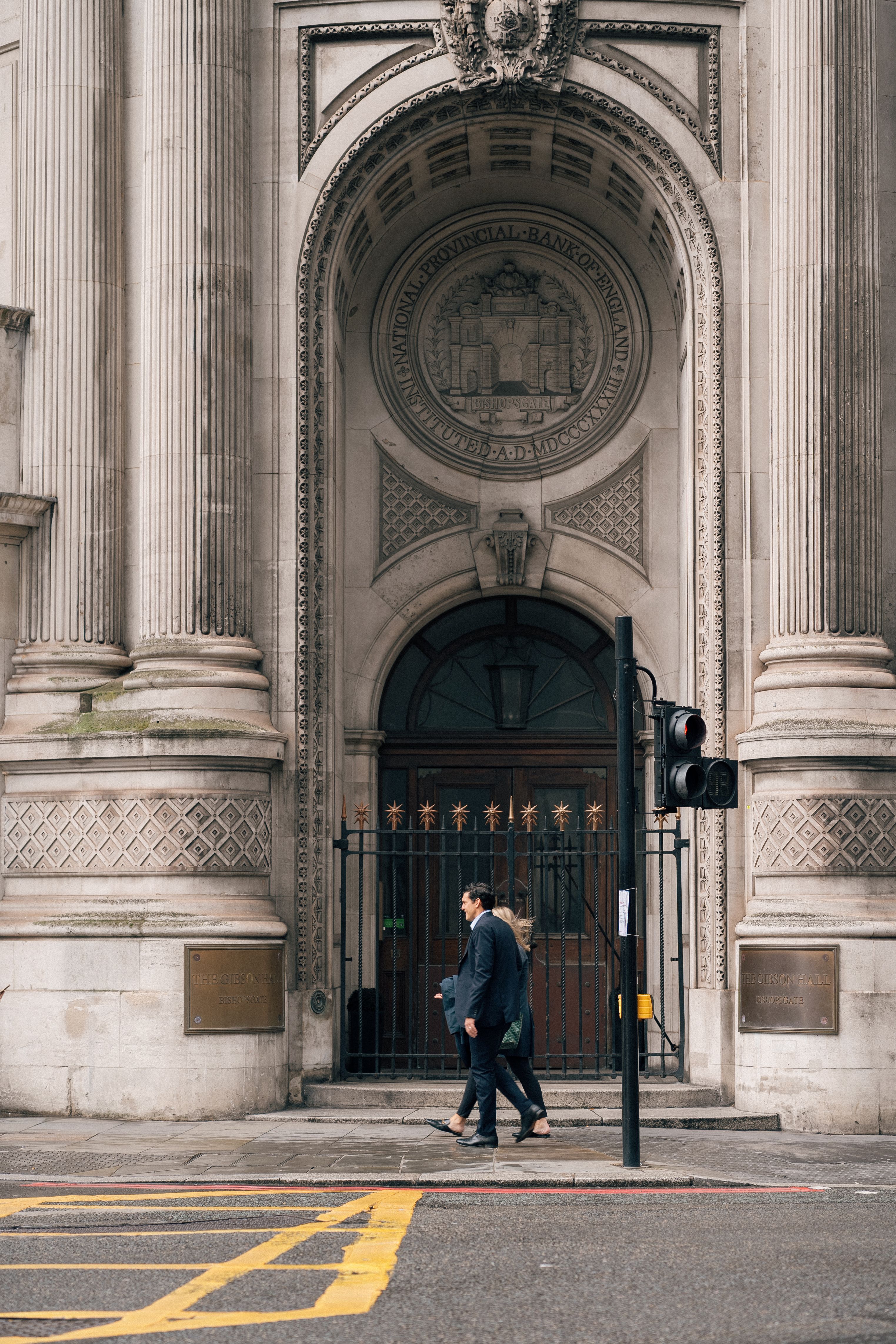Elegant Urban Street Scene with Classical Architecture · Free Stock Photo