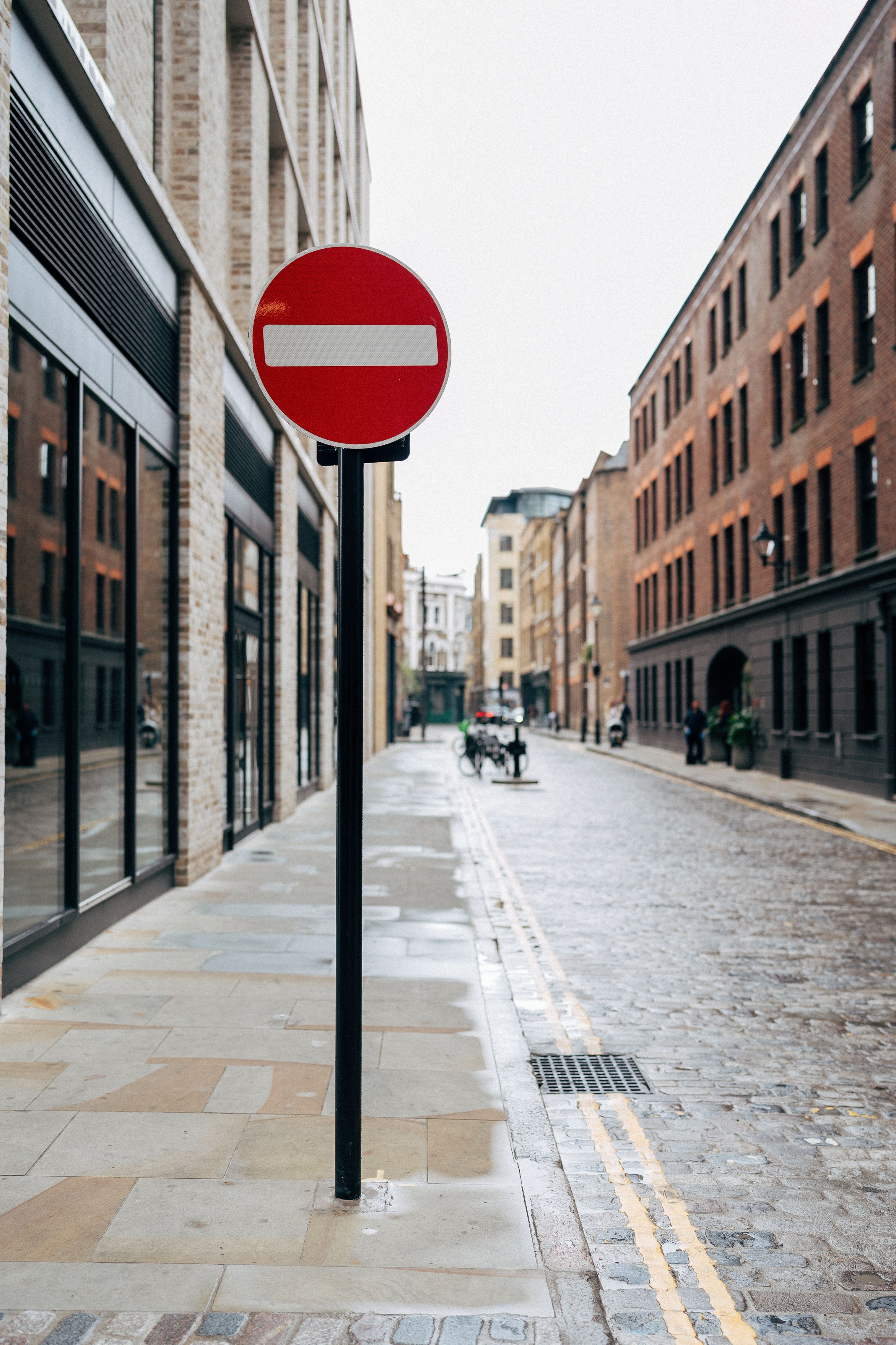 Empty Cobblestone Street with No Entry Sign · Free Stock Photo