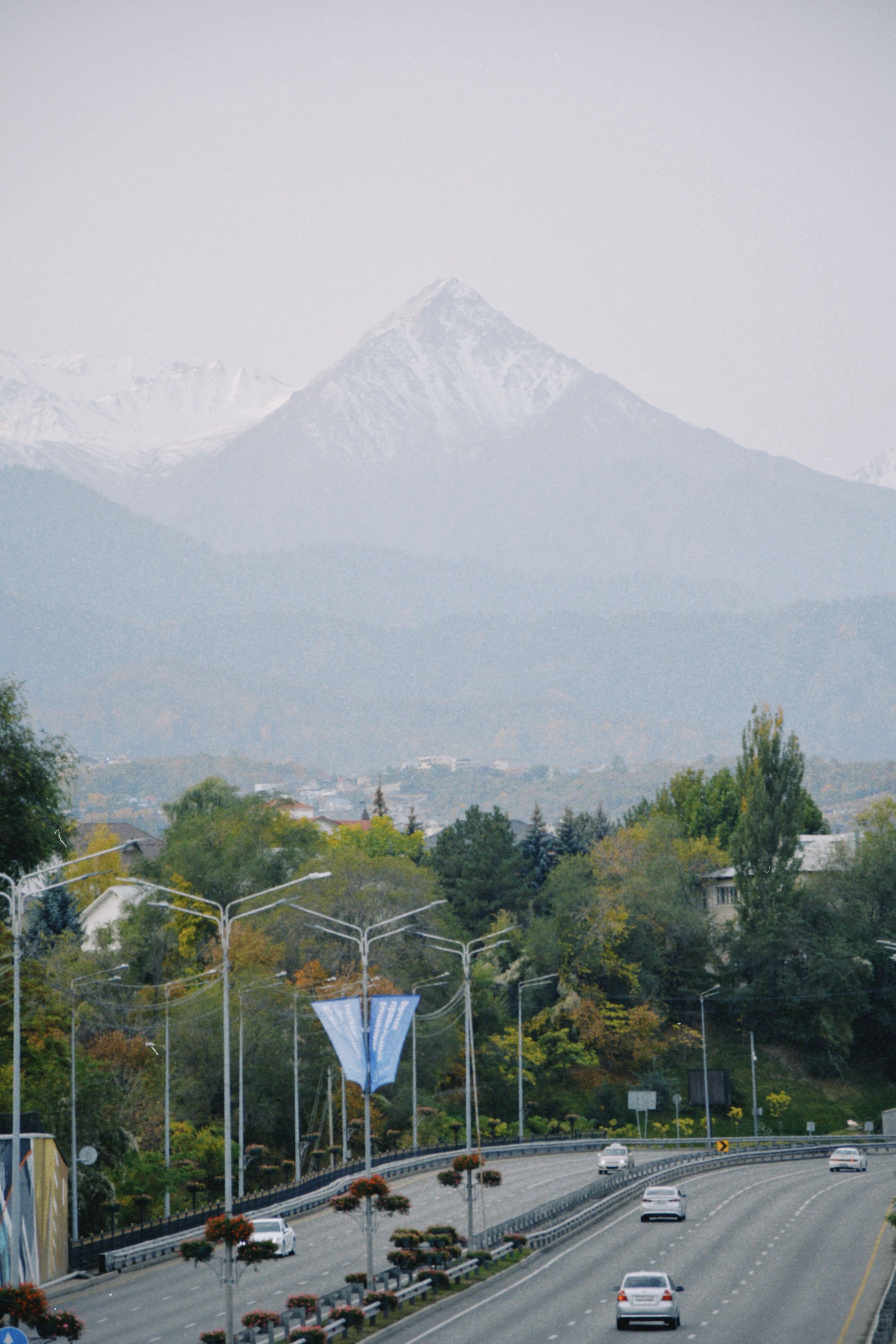 Scenic View of Almaty with Snow-Capped Mountains · Free Stock Photo