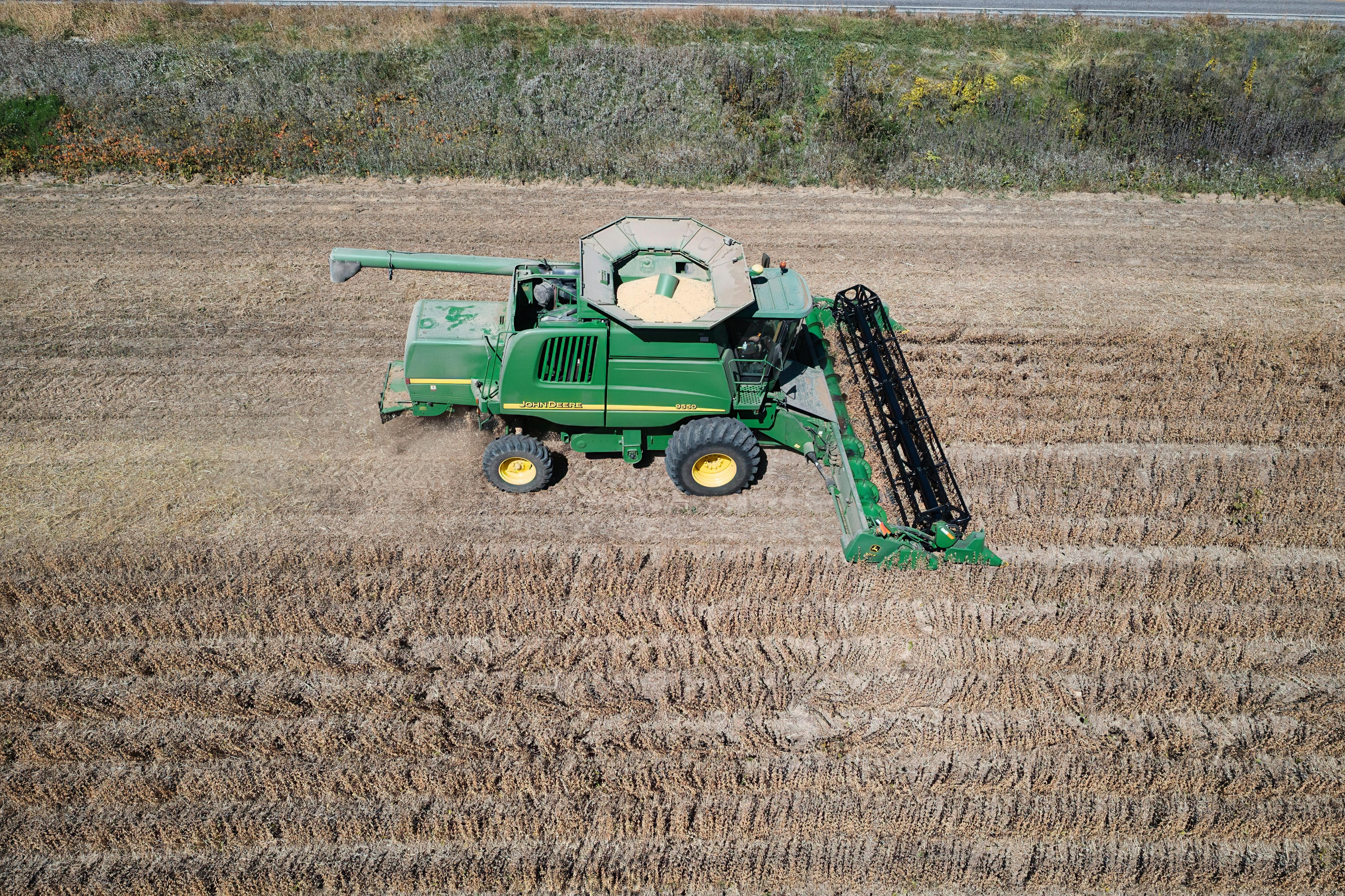 Aerial View of Combine Harvester in Field · Free Stock Photo