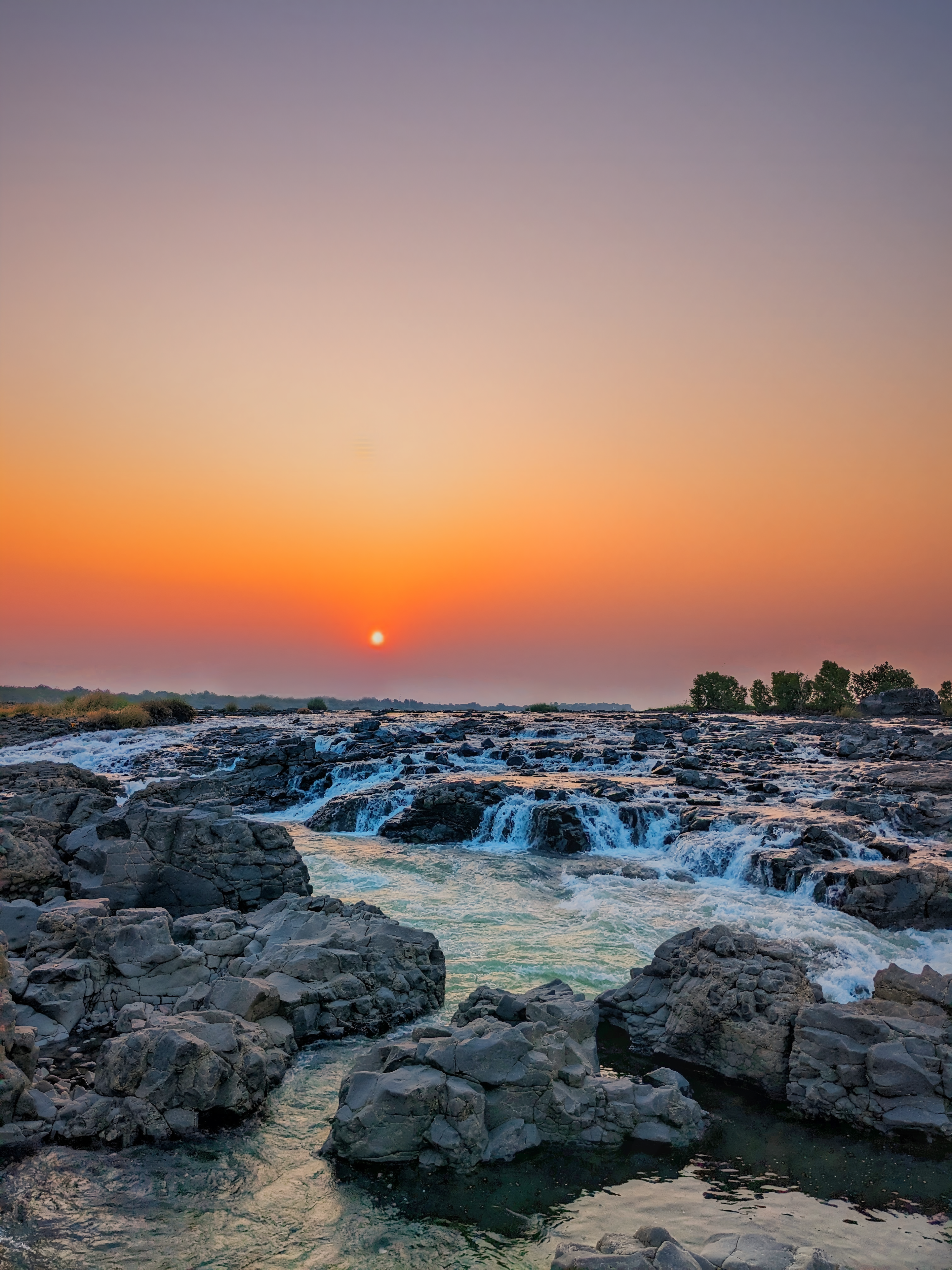 Stunning Sunset Over Tranquil Waterfall Landscape · Free Stock Photo