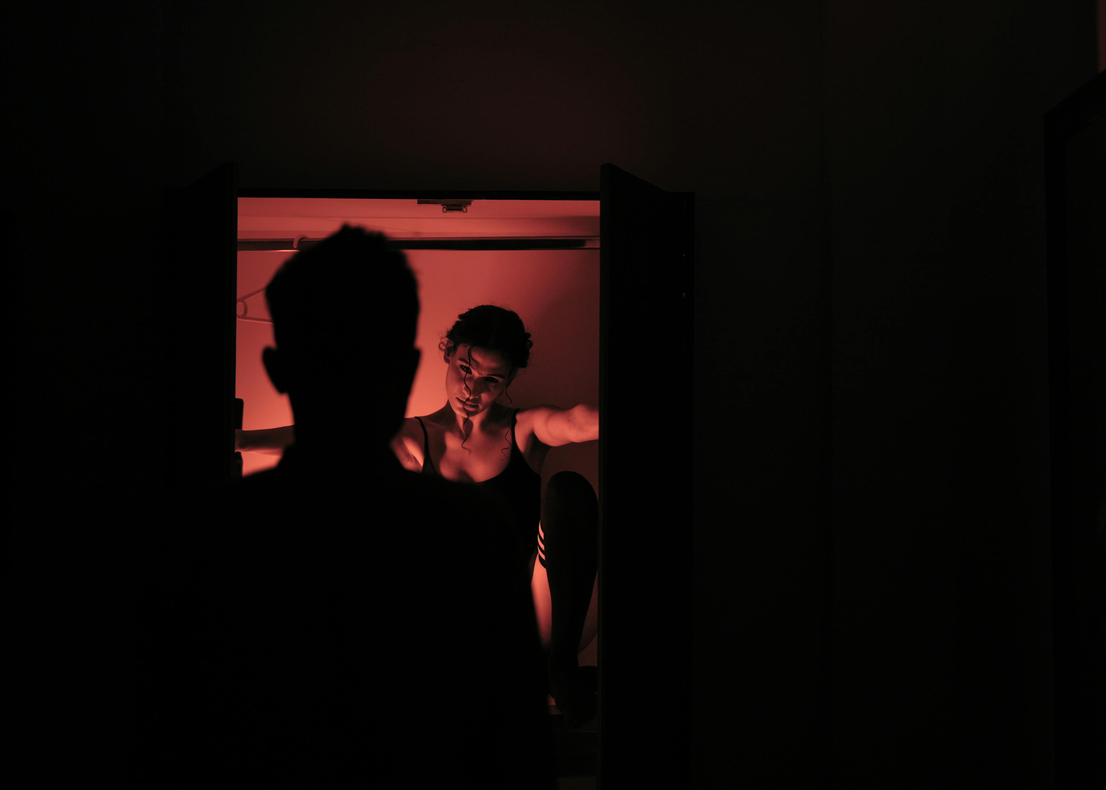 Silhouette of a Person with Red Backlighting · Free Stock Photo