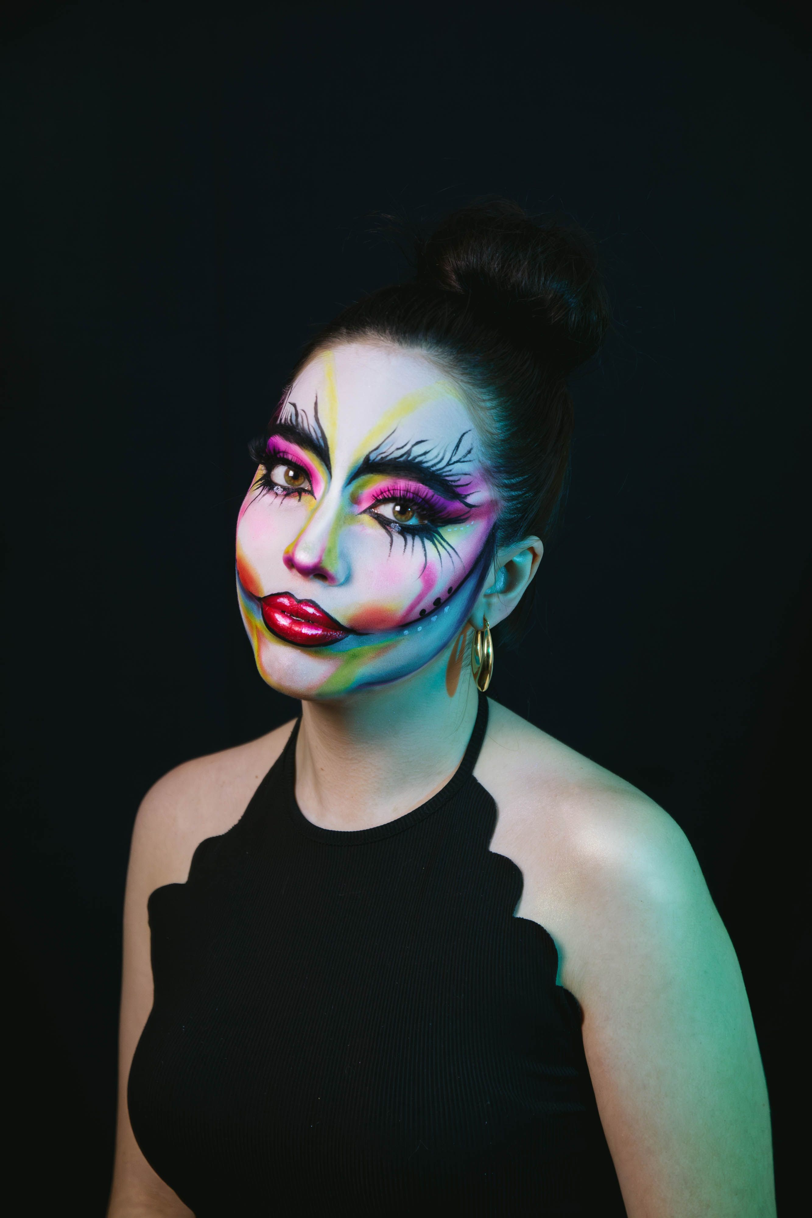 Vibrant Artistic Makeup Portrait in Studio · Free Stock Photo