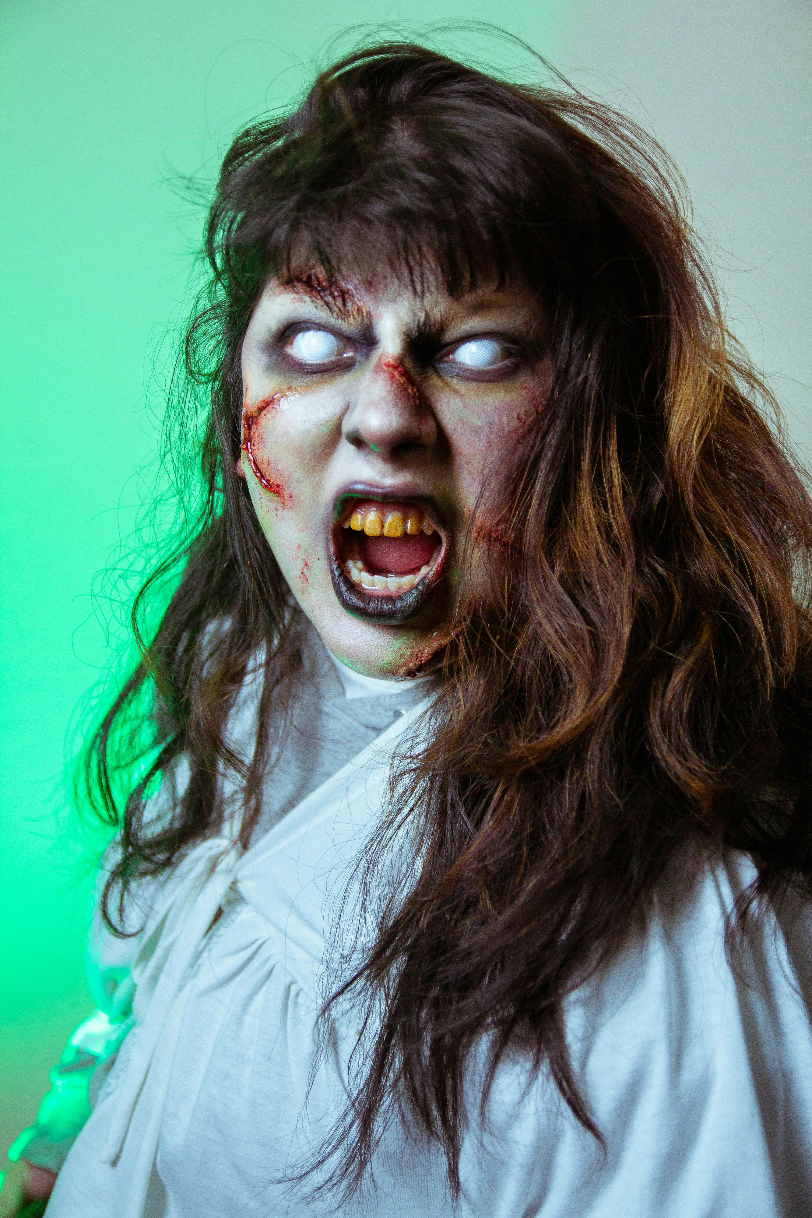Scary Zombie Woman with Glowing Eyes in Costume · Free Stock Photo