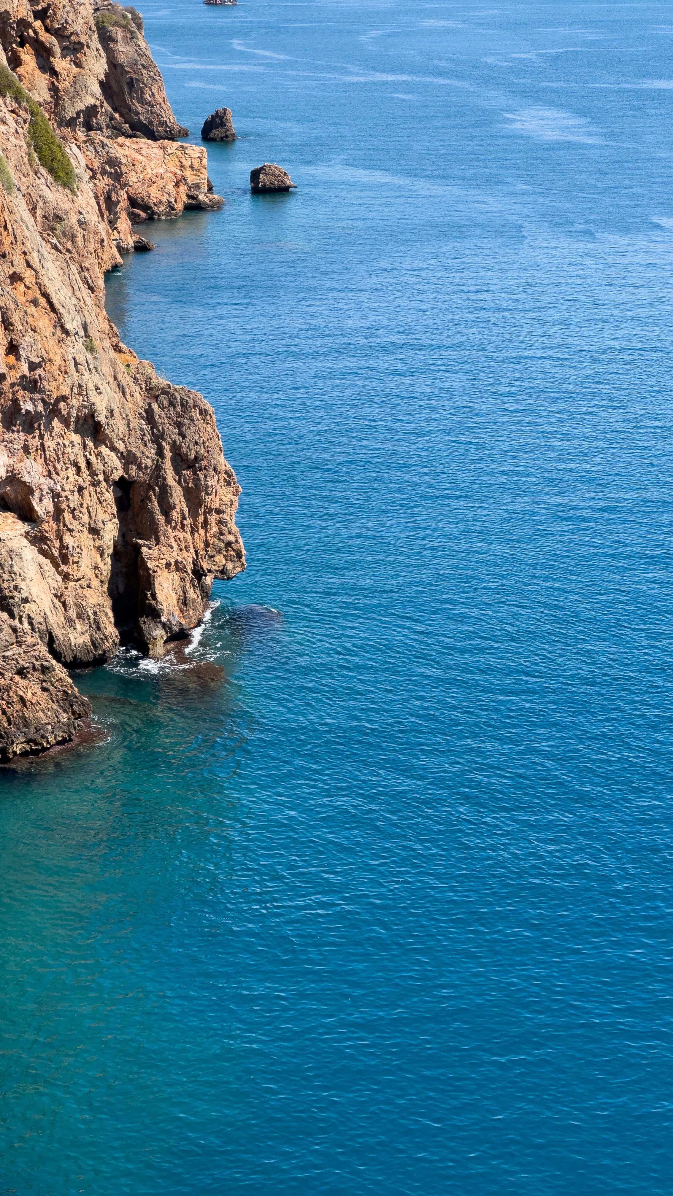 Cliffside View Overlooking Blue Ocean Water · Free Stock Photo