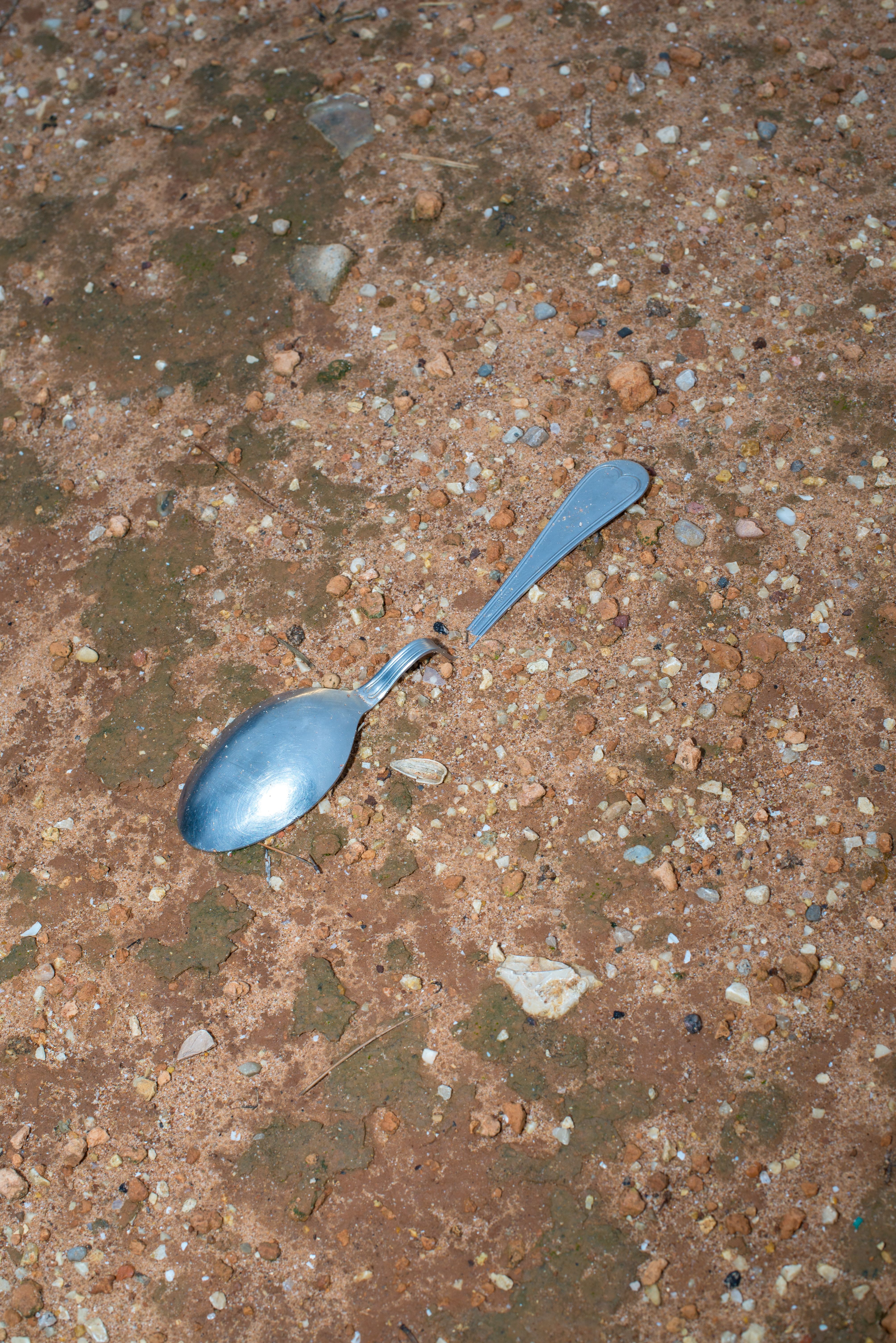 Metal Spoon on Rough Earth Surface · Free Stock Photo