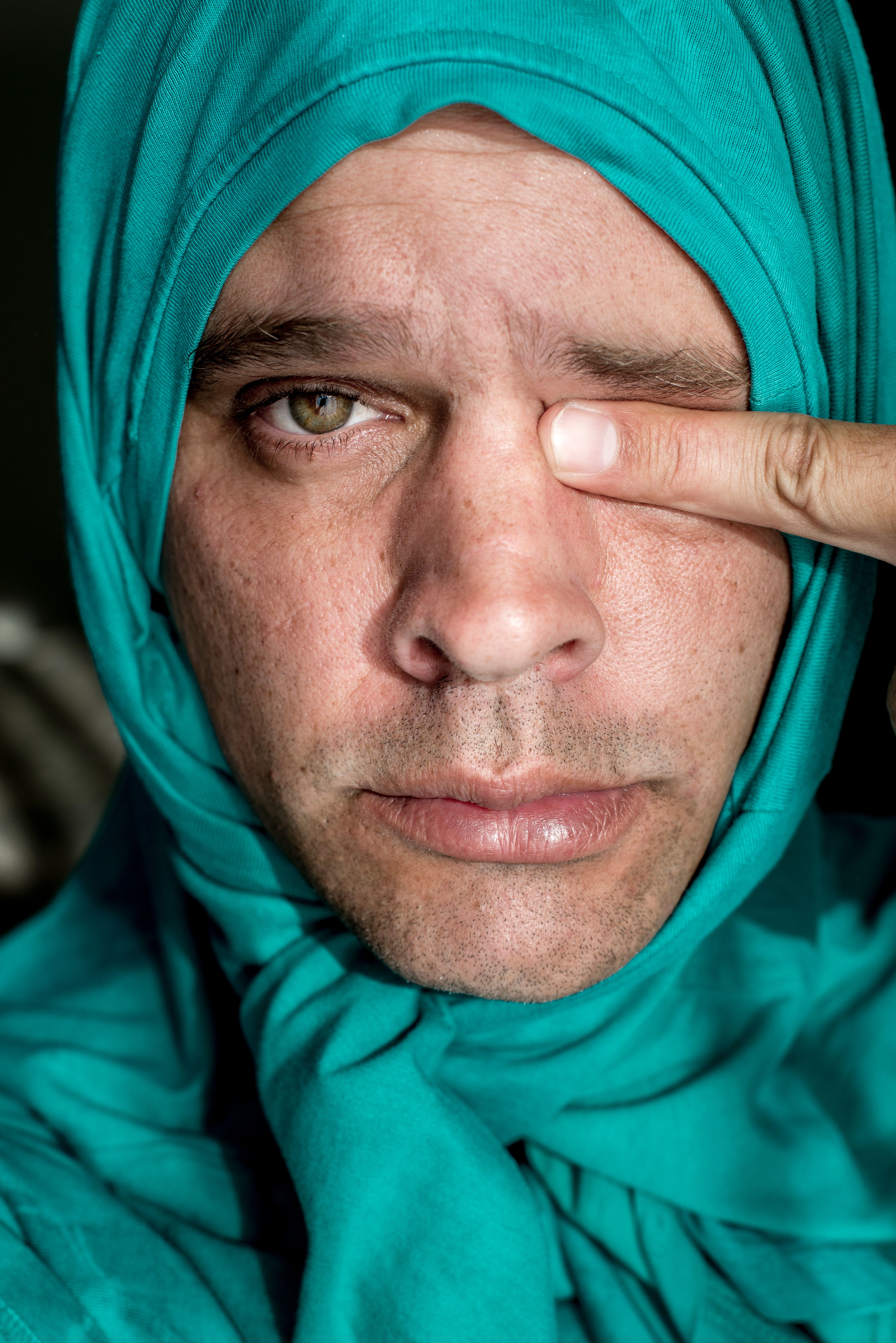 Portrait of a Man in Turquoise Headscarf · Free Stock Photo