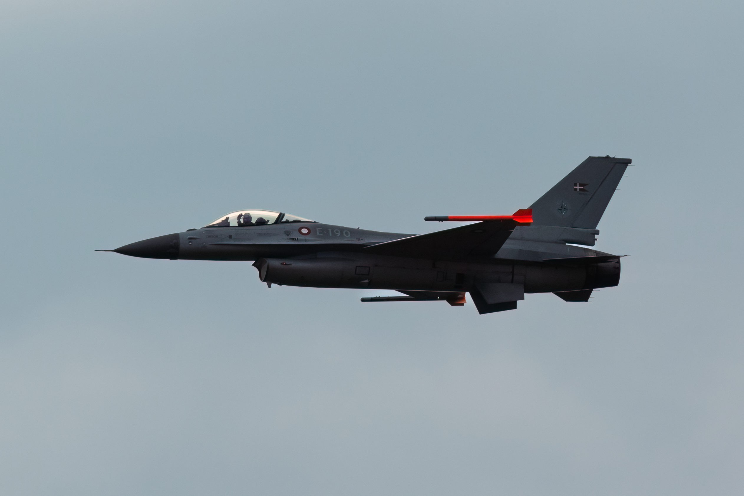 F-16 Fighter Jet in Flight Against Cloudy Sky · Free Stock Photo