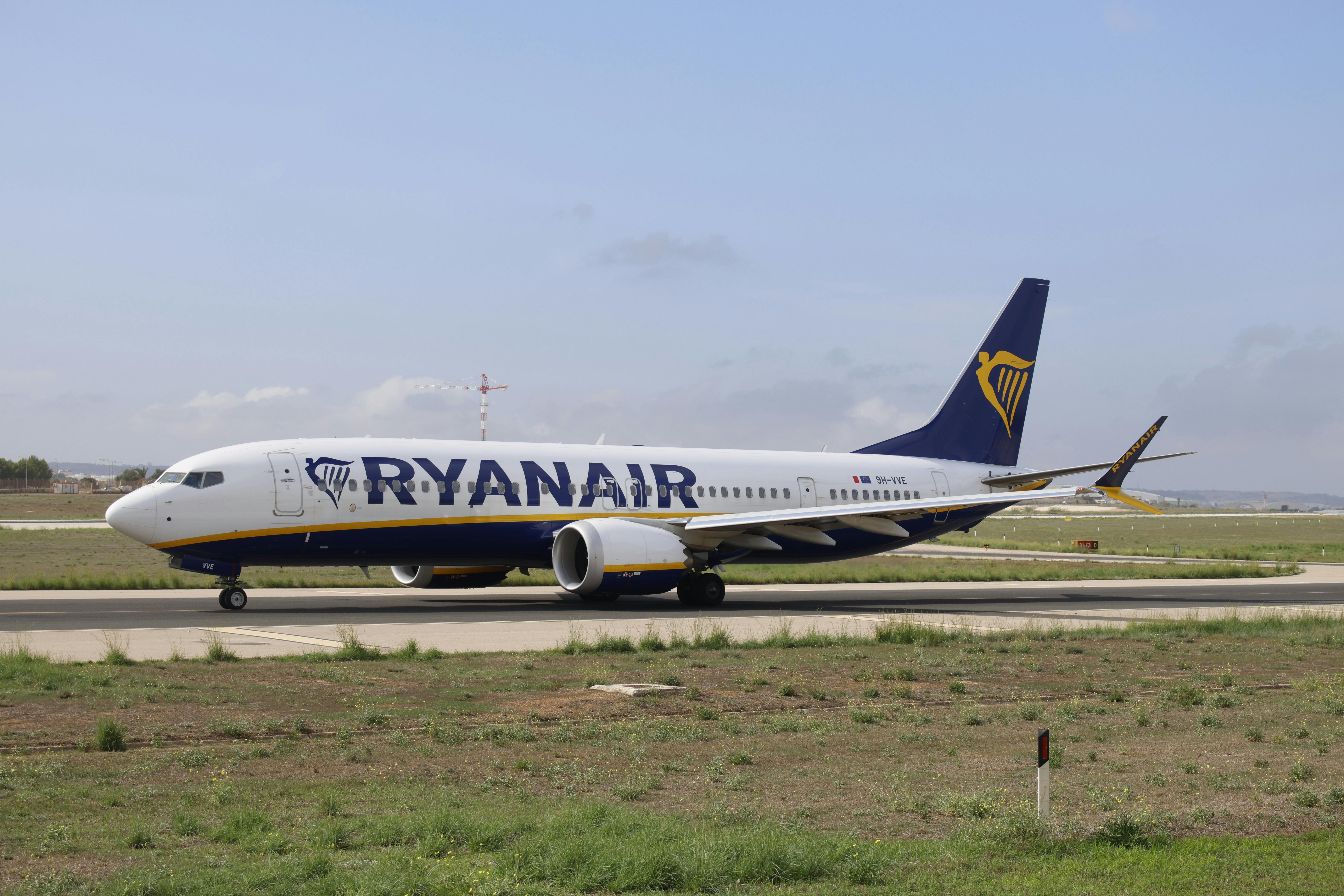 Ryanair Plane Taxiing on Runway at Airport · Free Stock Photo