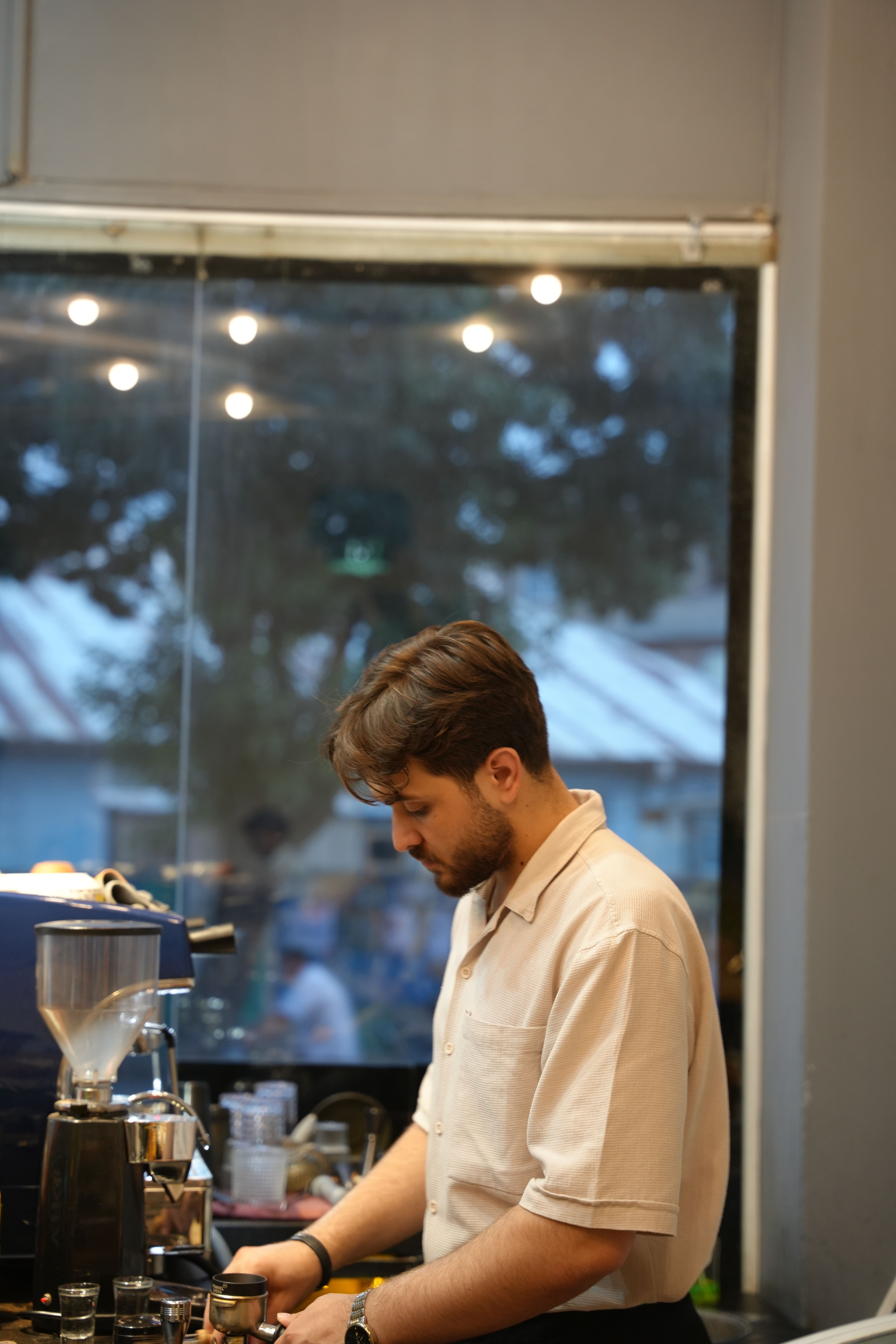 Barista Preparing Coffee in Modern Cafe · Free Stock Photo