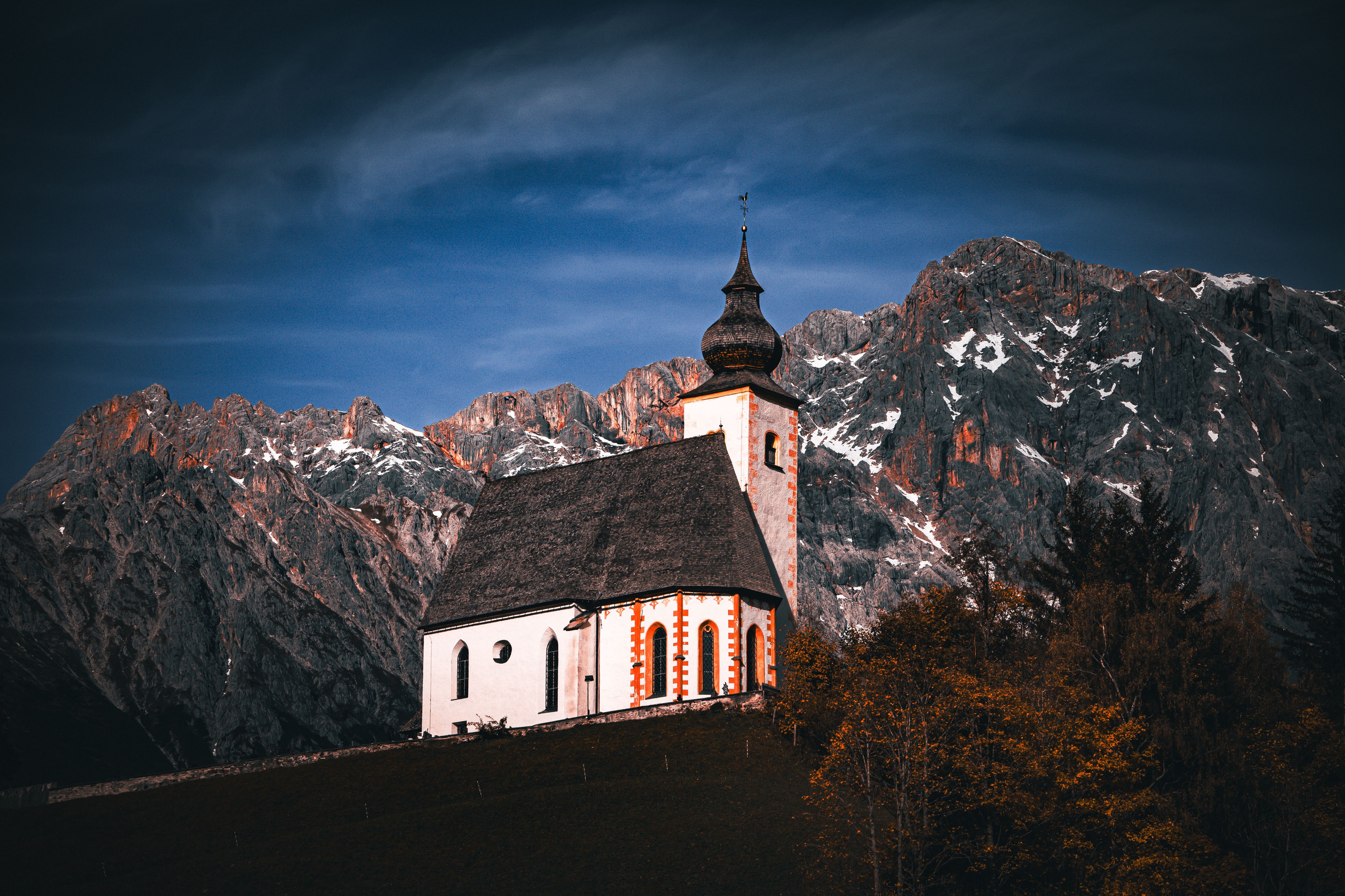 Scenic Alpine Church with Majestic Mountains · Free Stock Photo