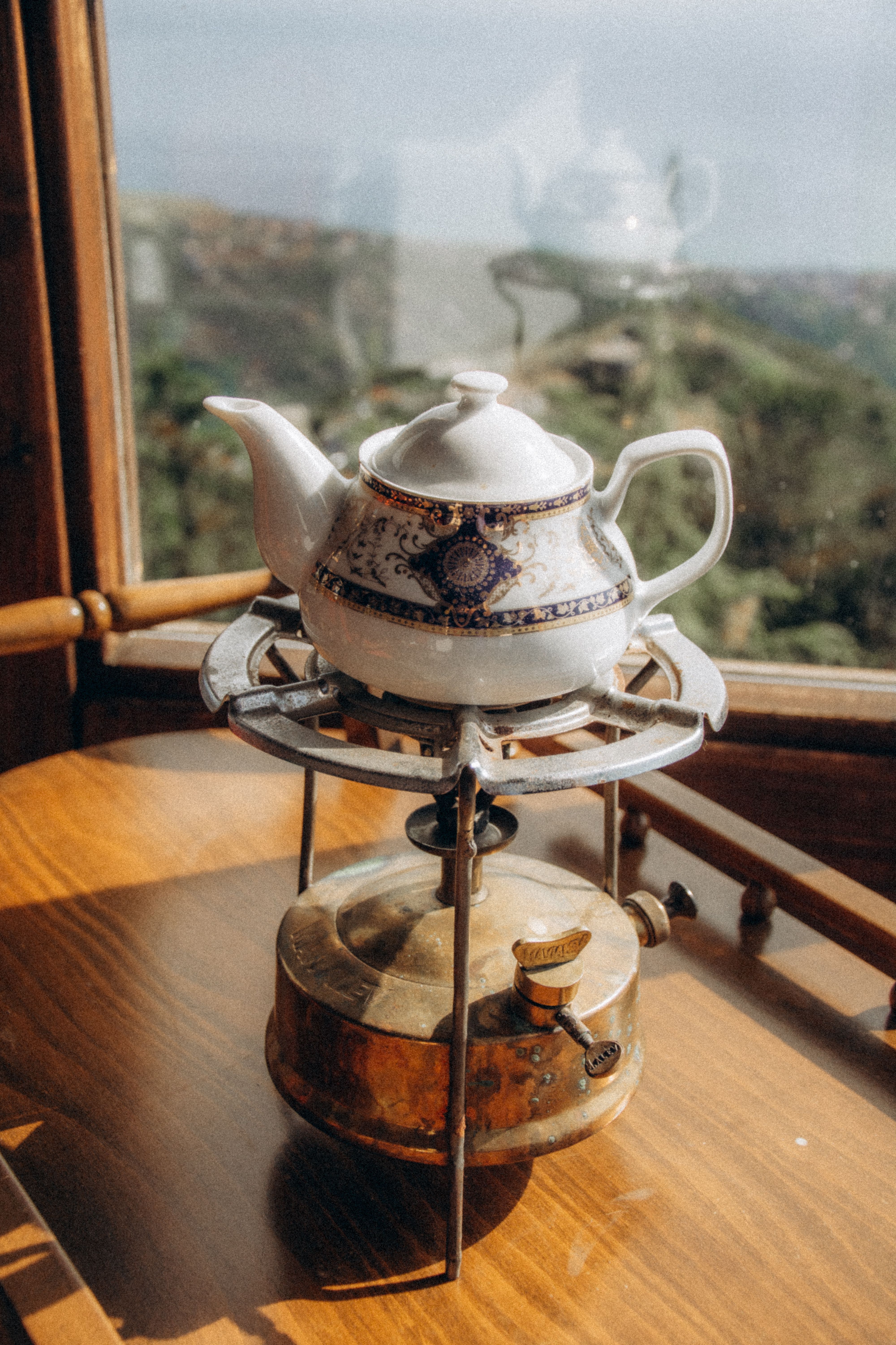 Elegant Vintage Teapot with Scenic View · Free Stock Photo
